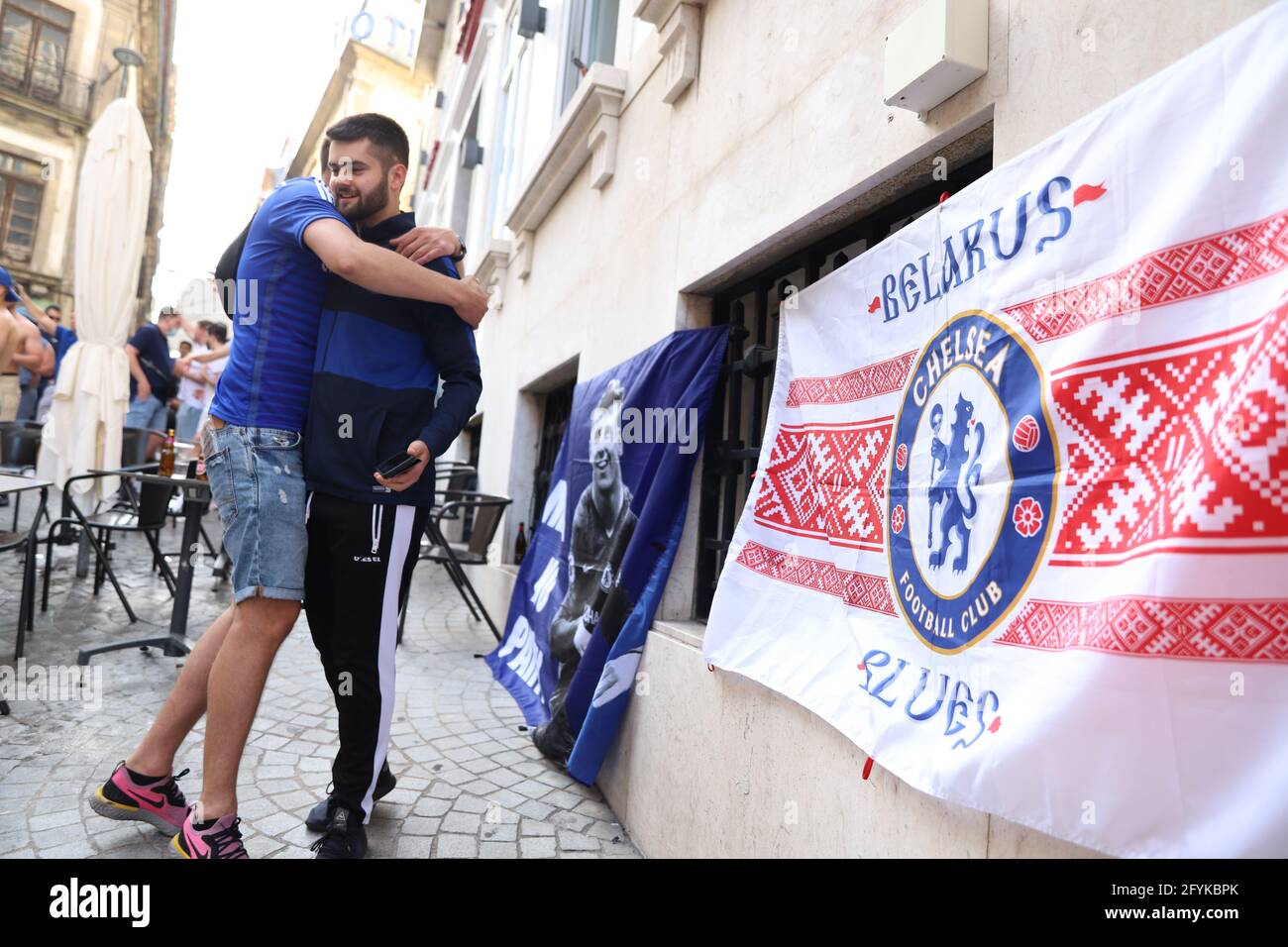 English fans of Chelsea and Manchester City drink beer in the host city ...