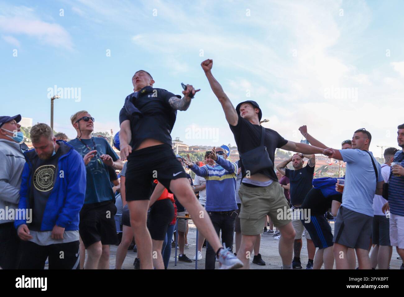 English fans of Chelsea and Manchester City drink beer in the host city ...