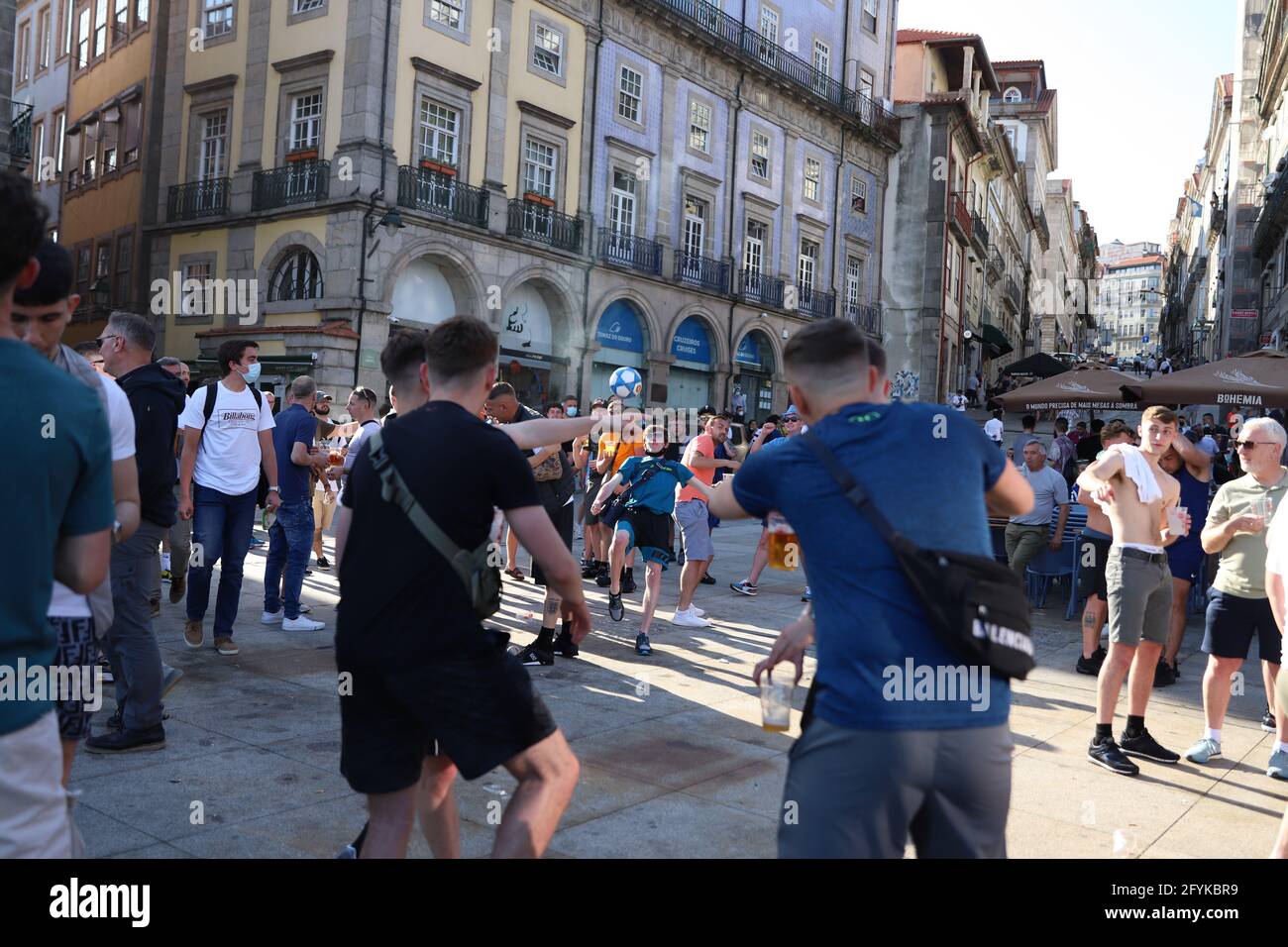 English fans of Chelsea and Manchester City drink beer in the host city ...