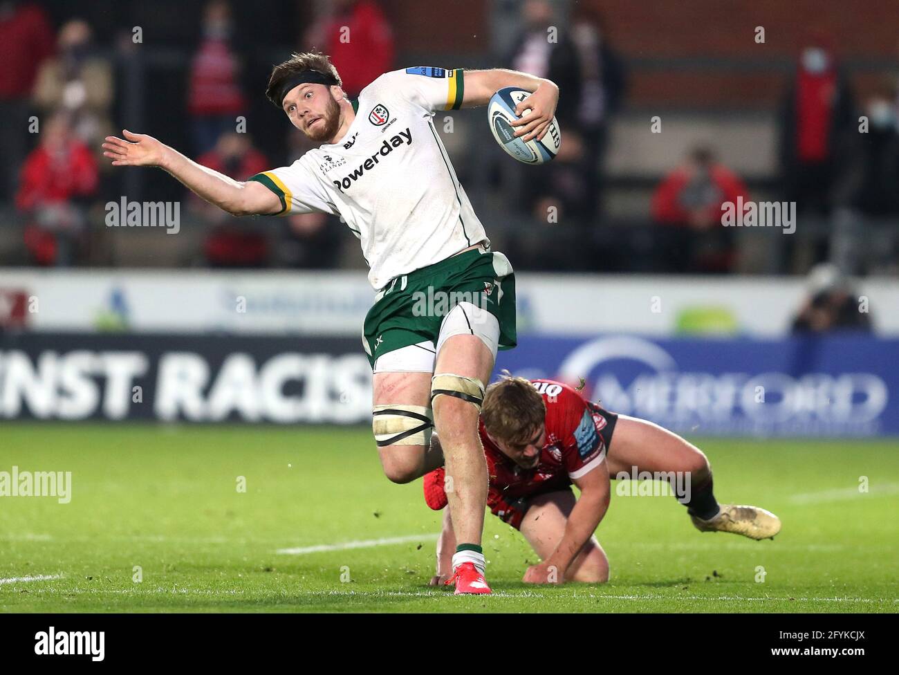 London Irish's Ben Donnell is tackled by Gloucester's Jack Singleton ...