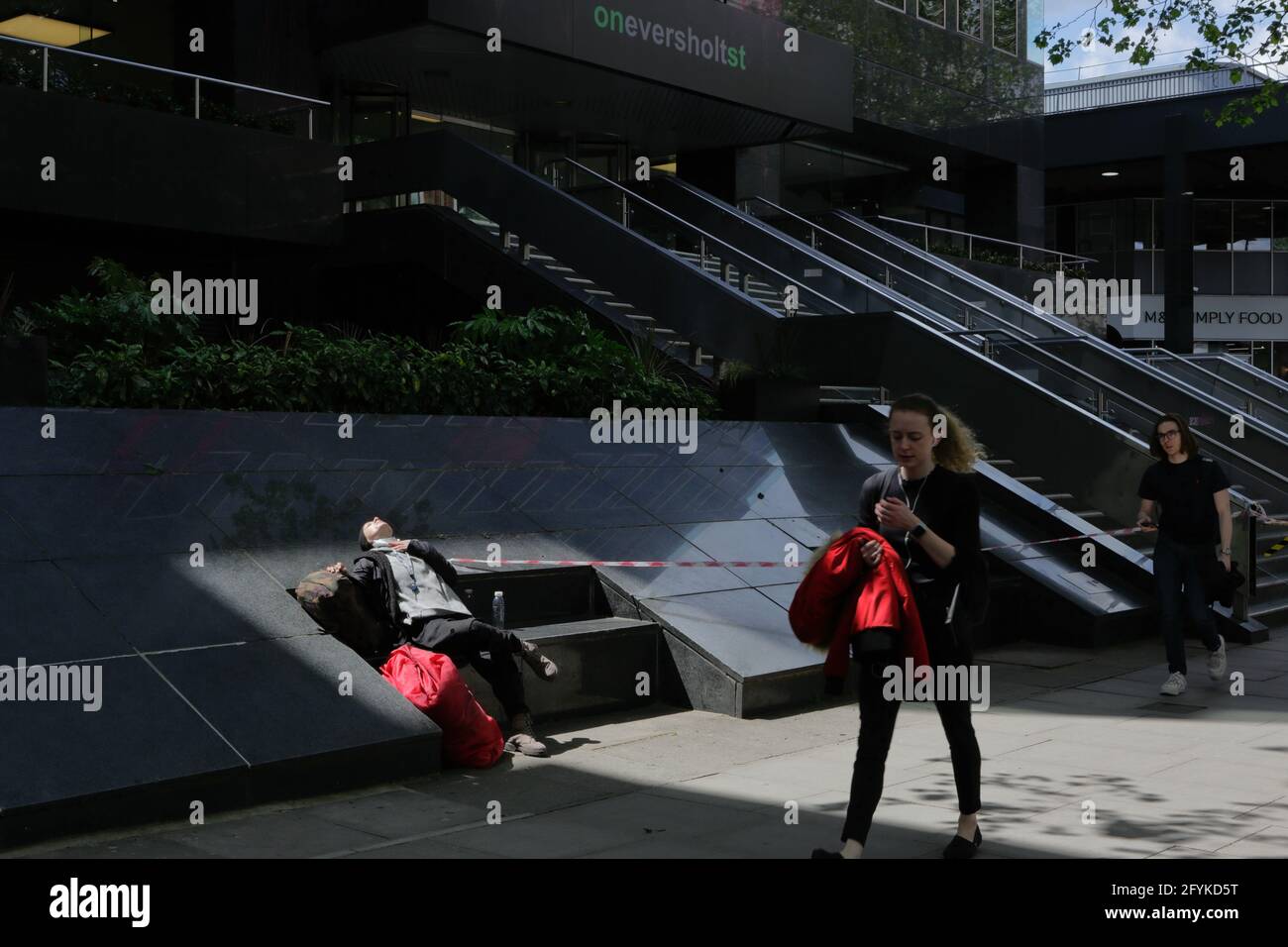 Homeless person sitting street backpack hi-res stock photography and ...
