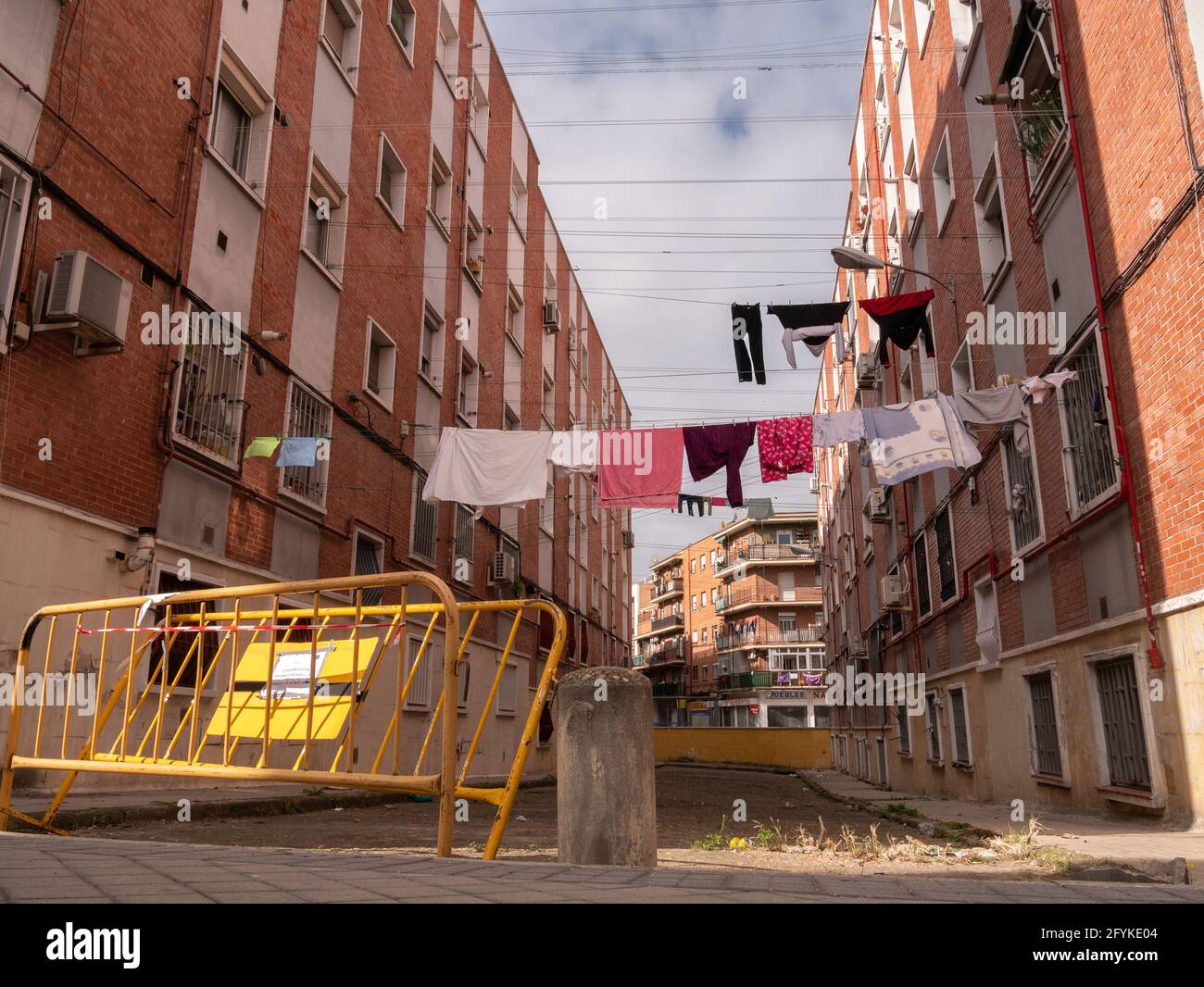 POOR NEIGHBORHOOD STREET WITH CLOTHES AND GARBAGE Stock Photo - Alamy