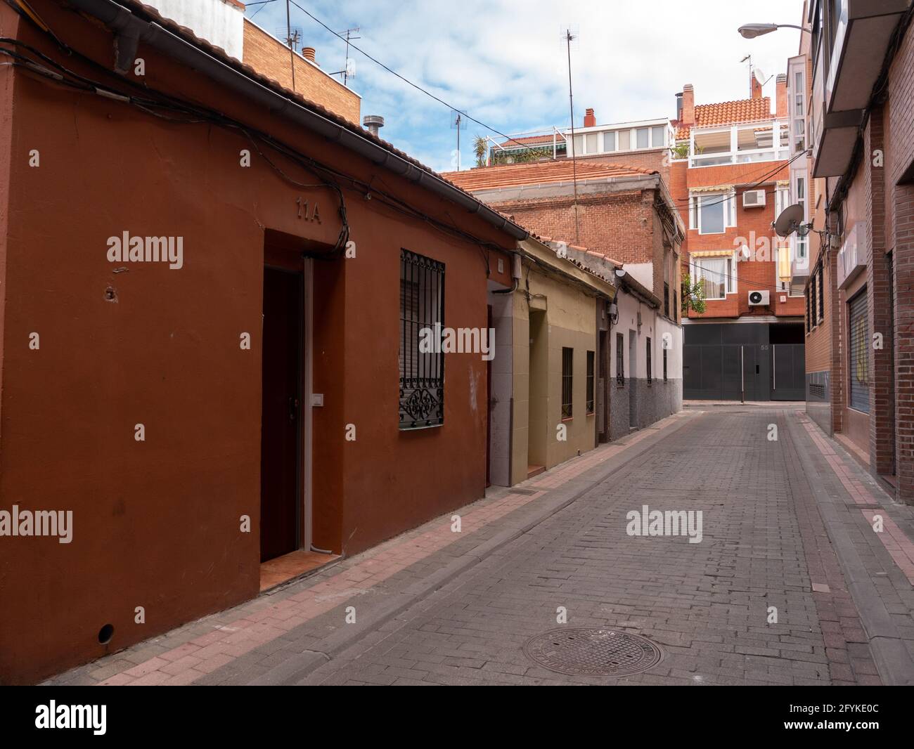 POOR NEIGHBORHOOD STREET WITH CLOTHES AND GARBAGE Stock Photo - Alamy