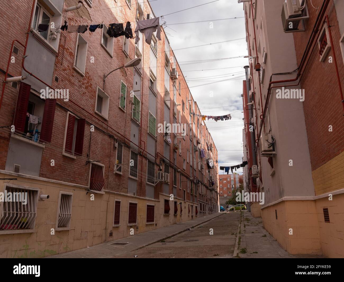 POOR NEIGHBORHOOD STREET WITH CLOTHES AND GARBAGE Stock Photo - Alamy