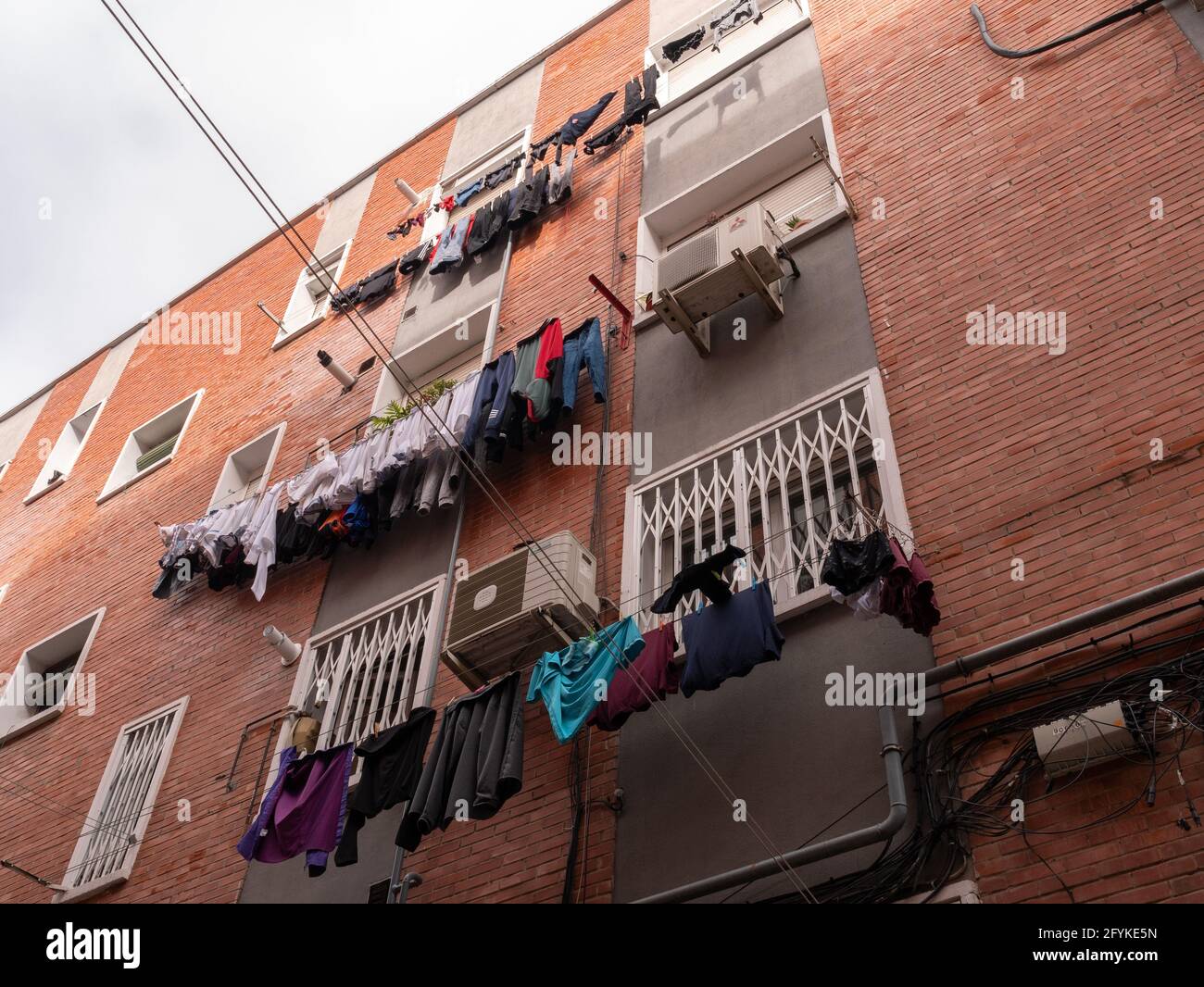 POOR NEIGHBORHOOD STREET WITH CLOTHES AND GARBAGE Stock Photo - Alamy