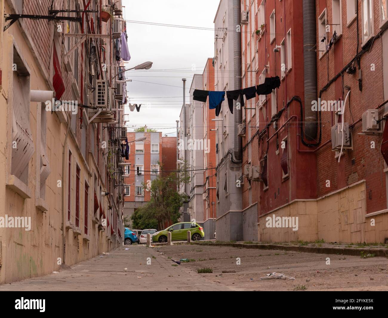POOR NEIGHBORHOOD STREET WITH CLOTHES AND GARBAGE Stock Photo - Alamy