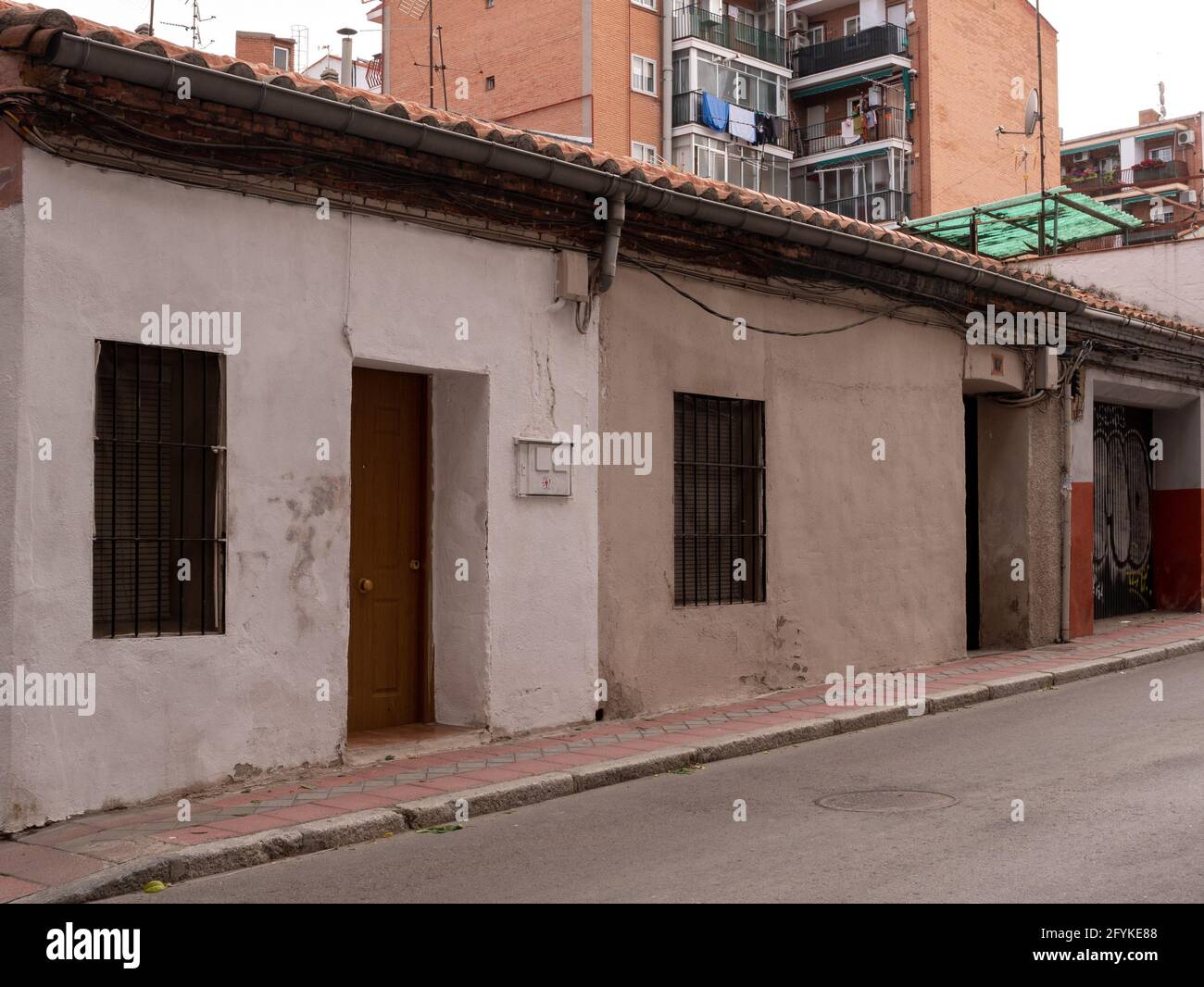 POOR NEIGHBORHOOD STREET WITH CLOTHES AND GARBAGE Stock Photo - Alamy