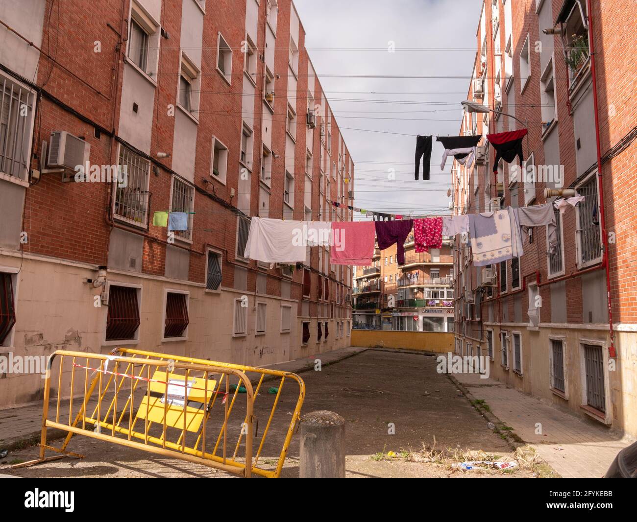 POOR NEIGHBORHOOD STREET WITH CLOTHES AND GARBAGE Stock Photo - Alamy