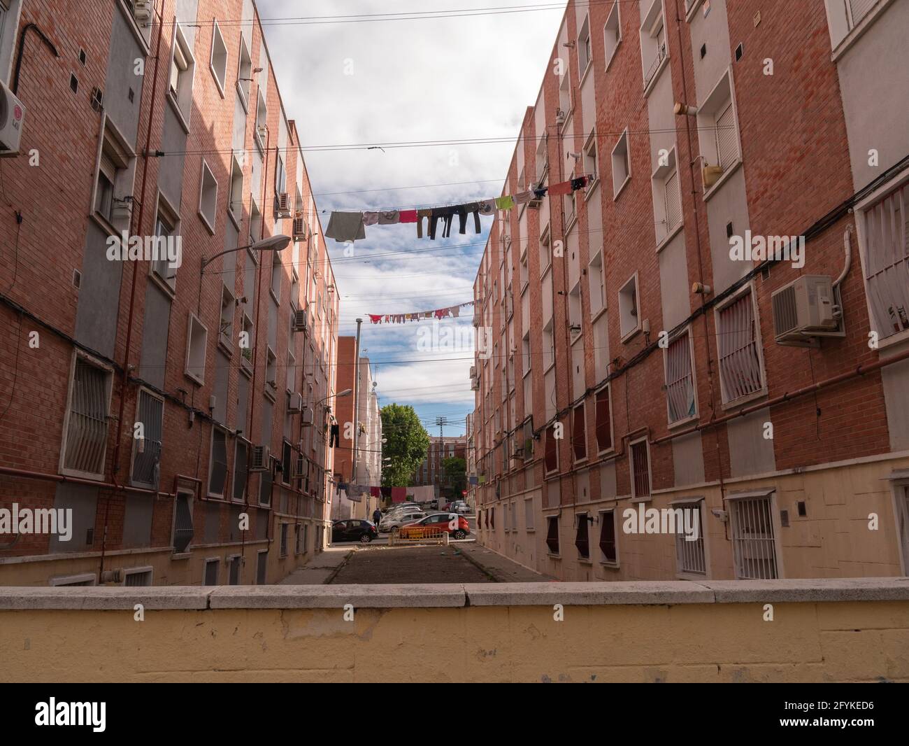 POOR NEIGHBORHOOD STREET WITH CLOTHES AND GARBAGE Stock Photo - Alamy