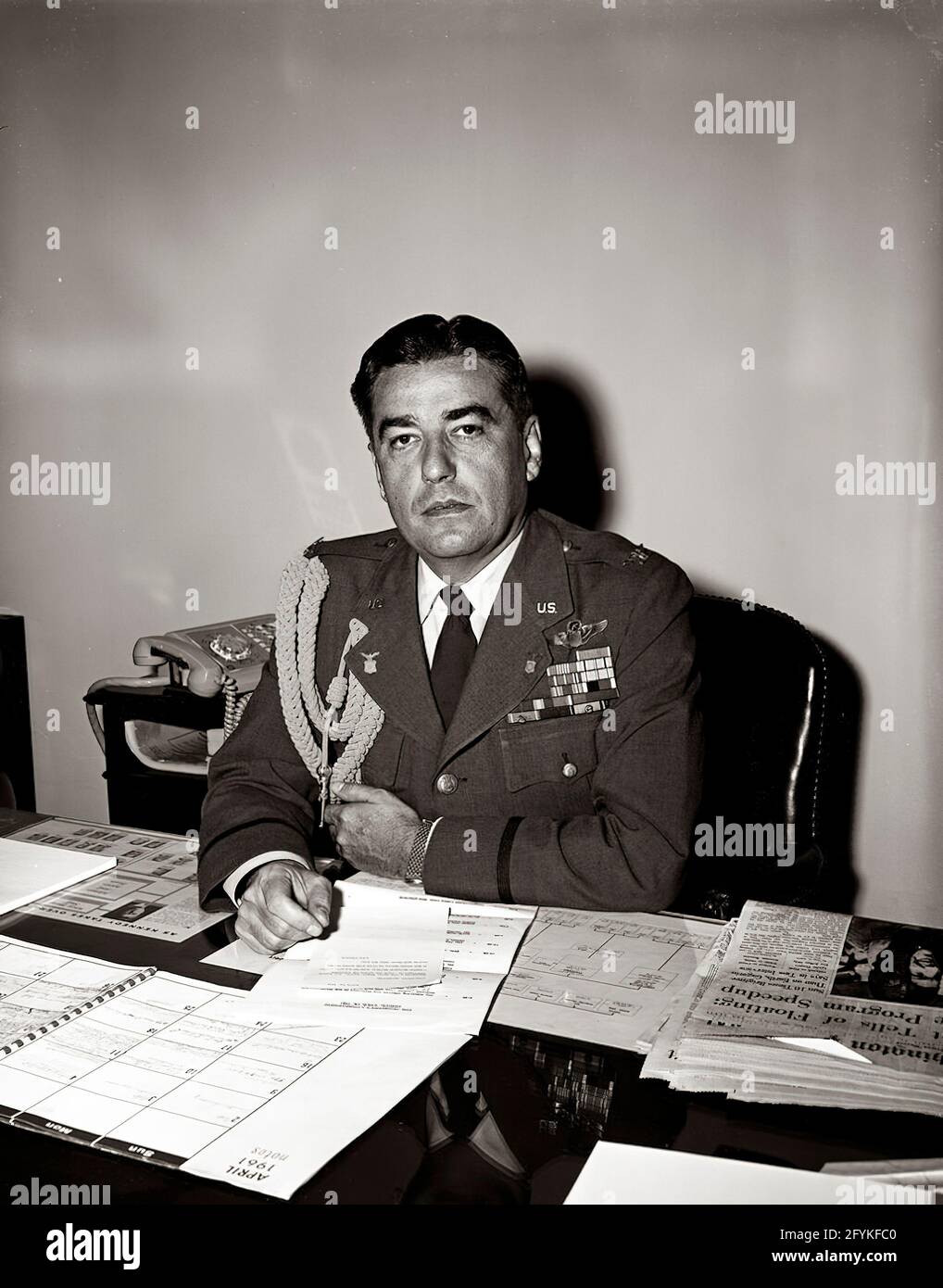 Air Force Aide to the President General Godfrey T. McHugh at a desk in ...