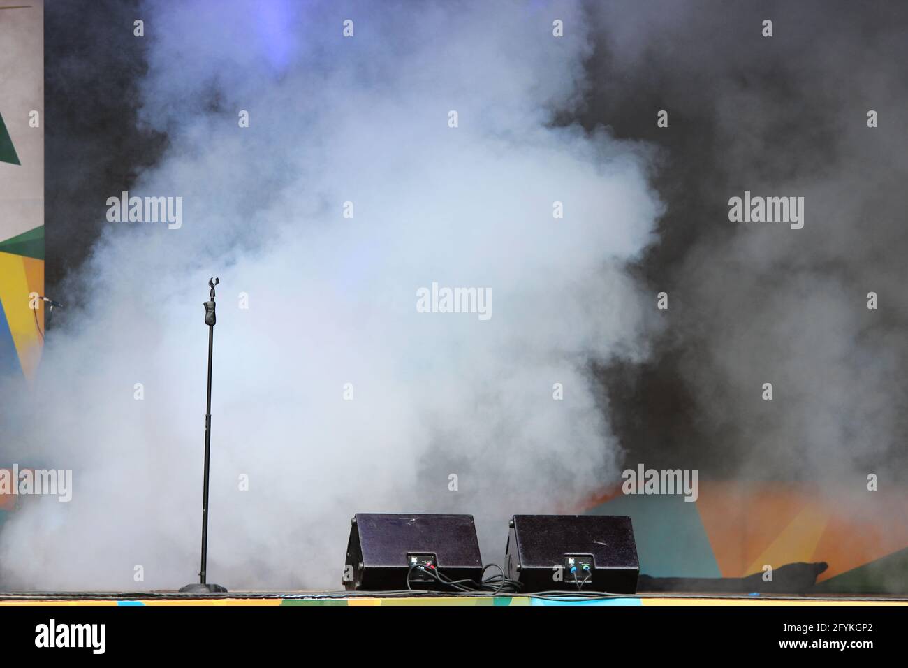 illuminated stage smoke created with a smoke generator for a ...