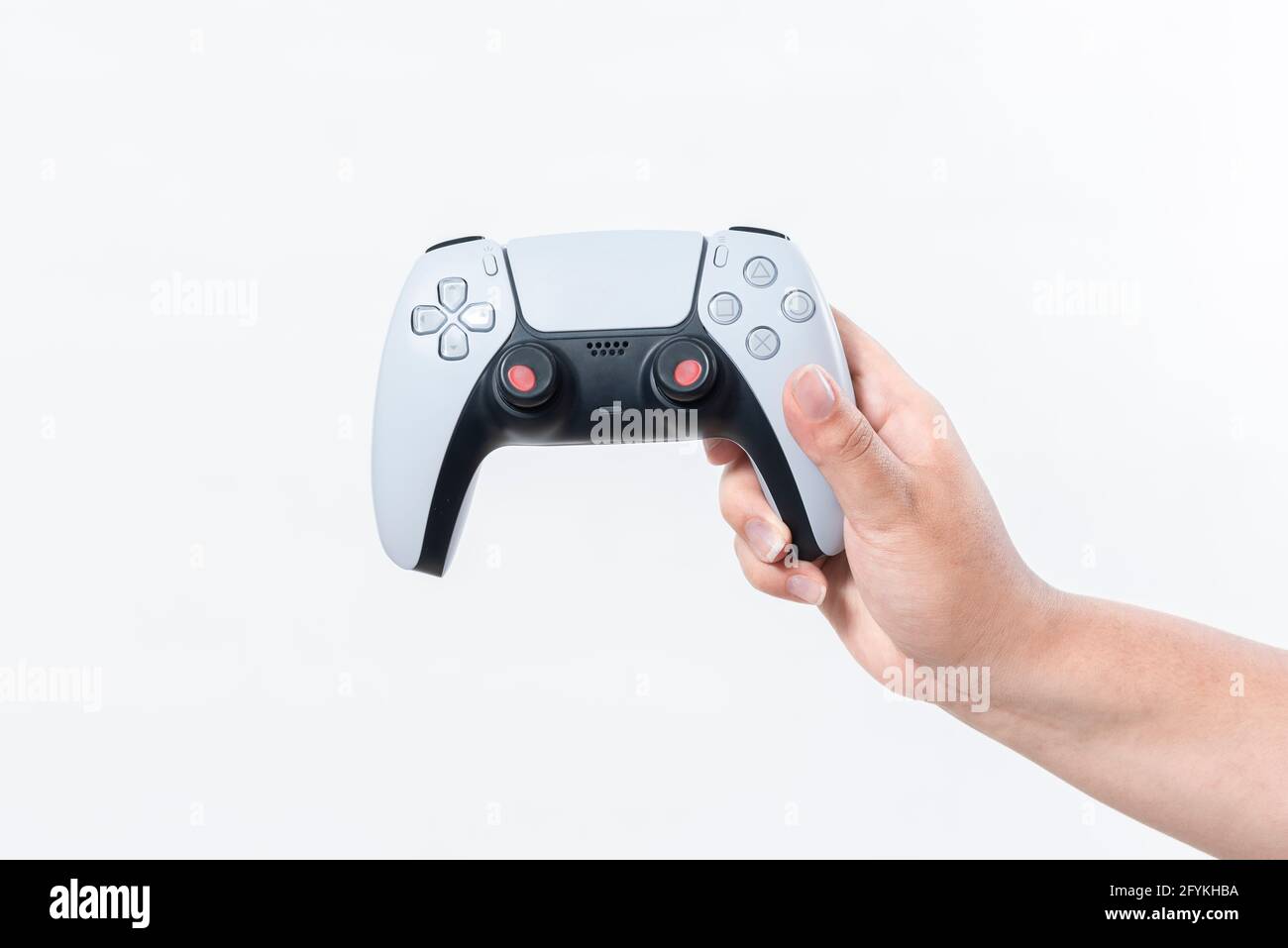 female hand holding video game controller, space for text over white ...