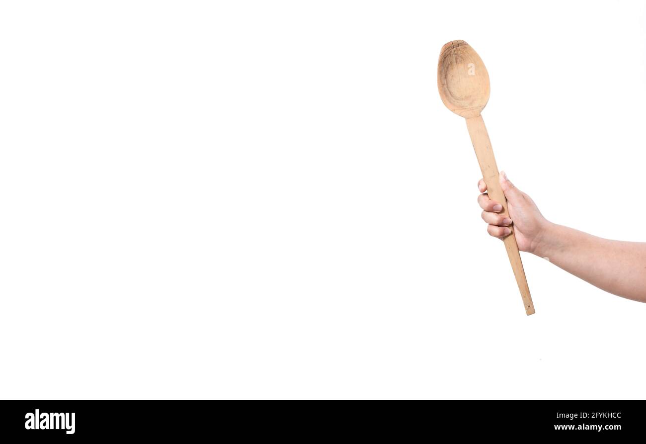 woman hand holding wooden spoon isolated on white background, space for ...
