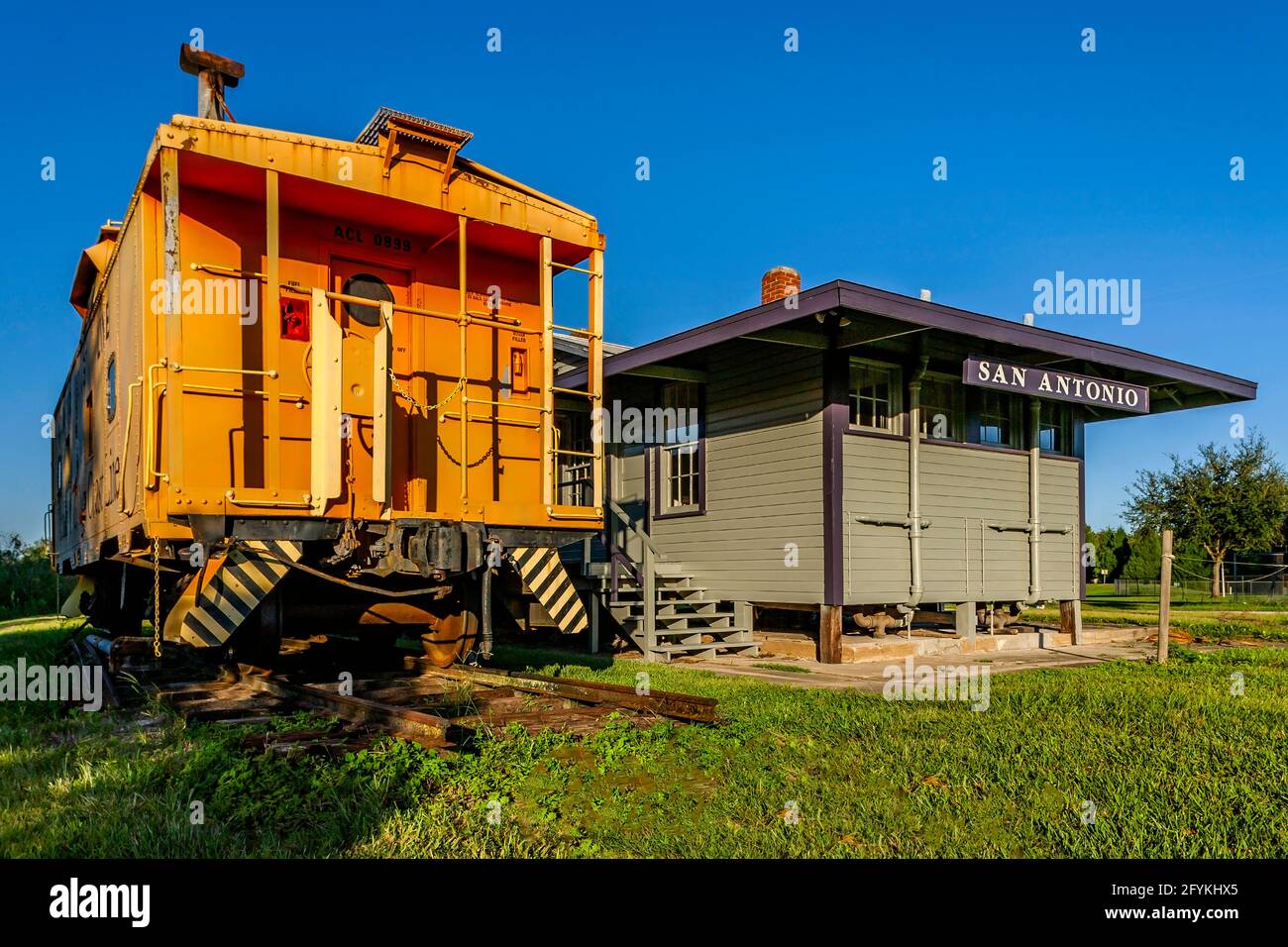 Yellow caboose in the back of the San Antonio train depot museum, San ...