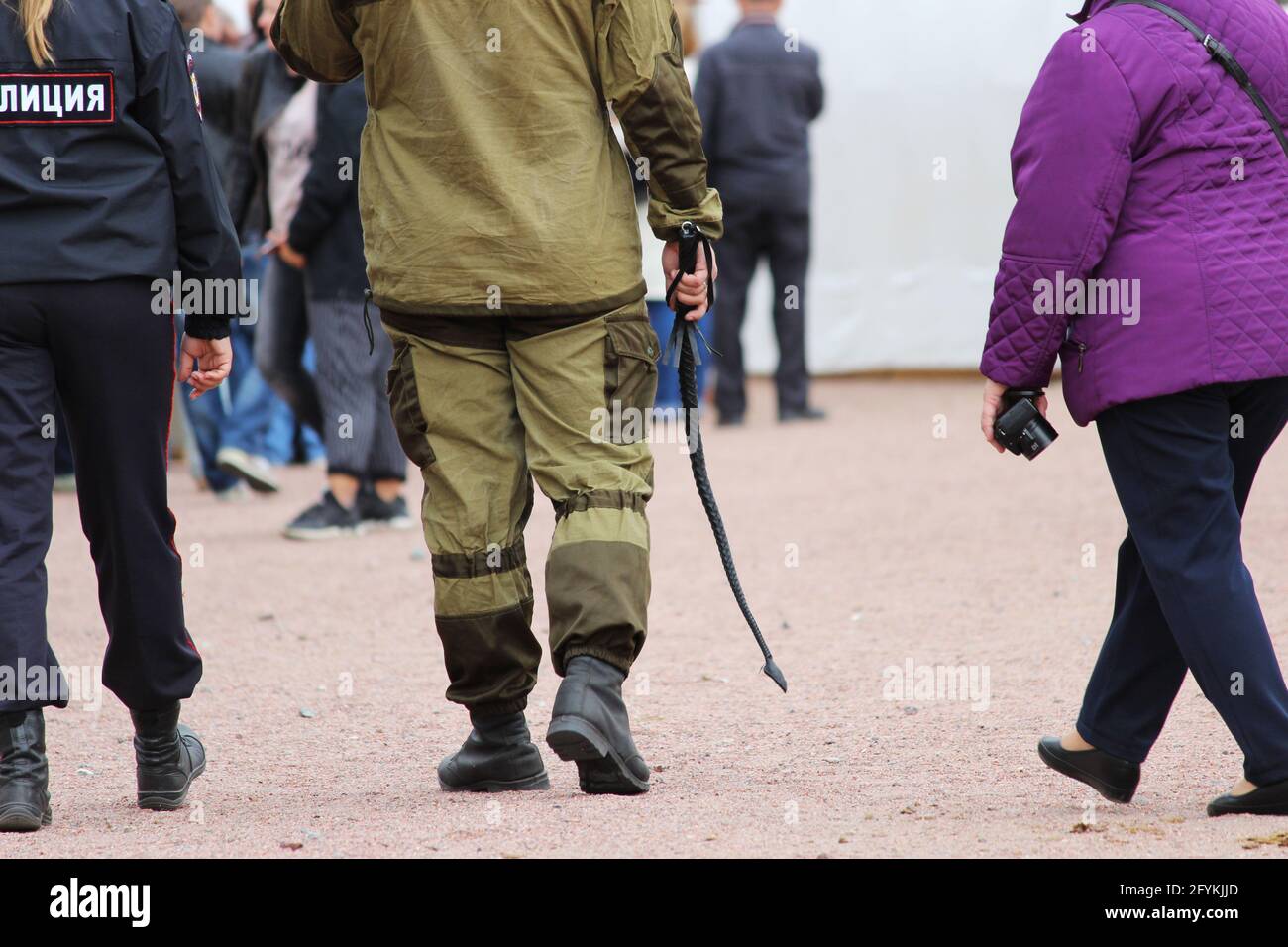 security guard from a private security agency patrols the square with ...