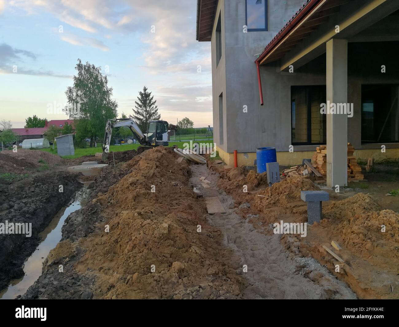 Drainage ditch close to individual house under construction in ...