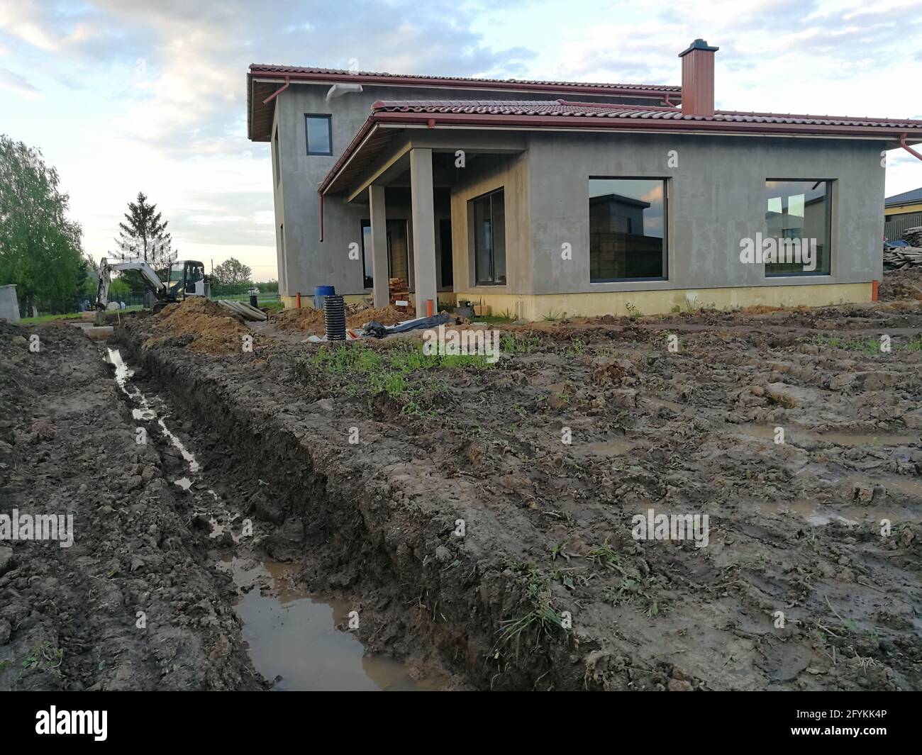 Drainage ditch close to individual house under construction in ...