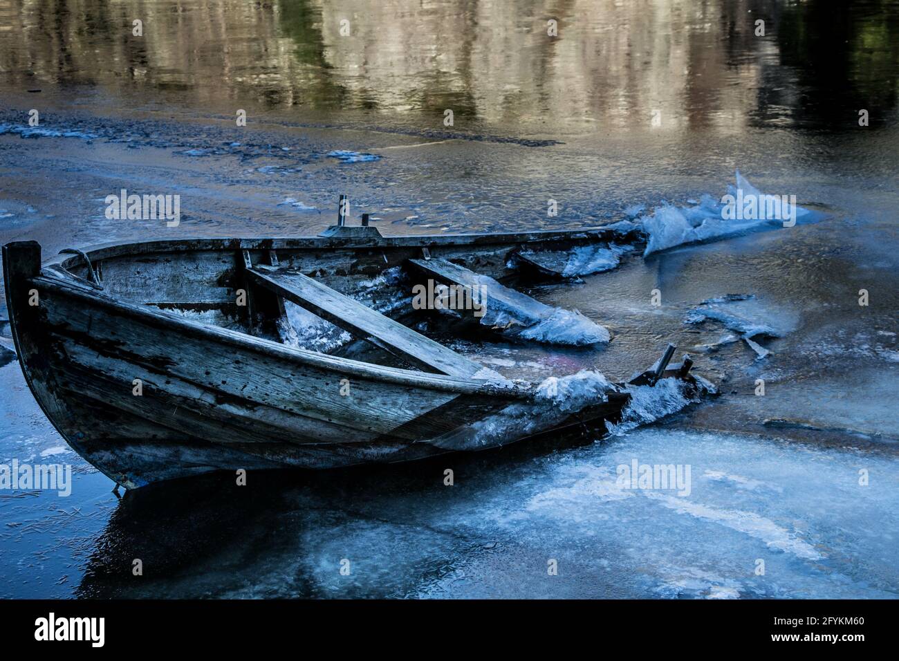 Old broken boat on river bank Stock Photo - Alamy