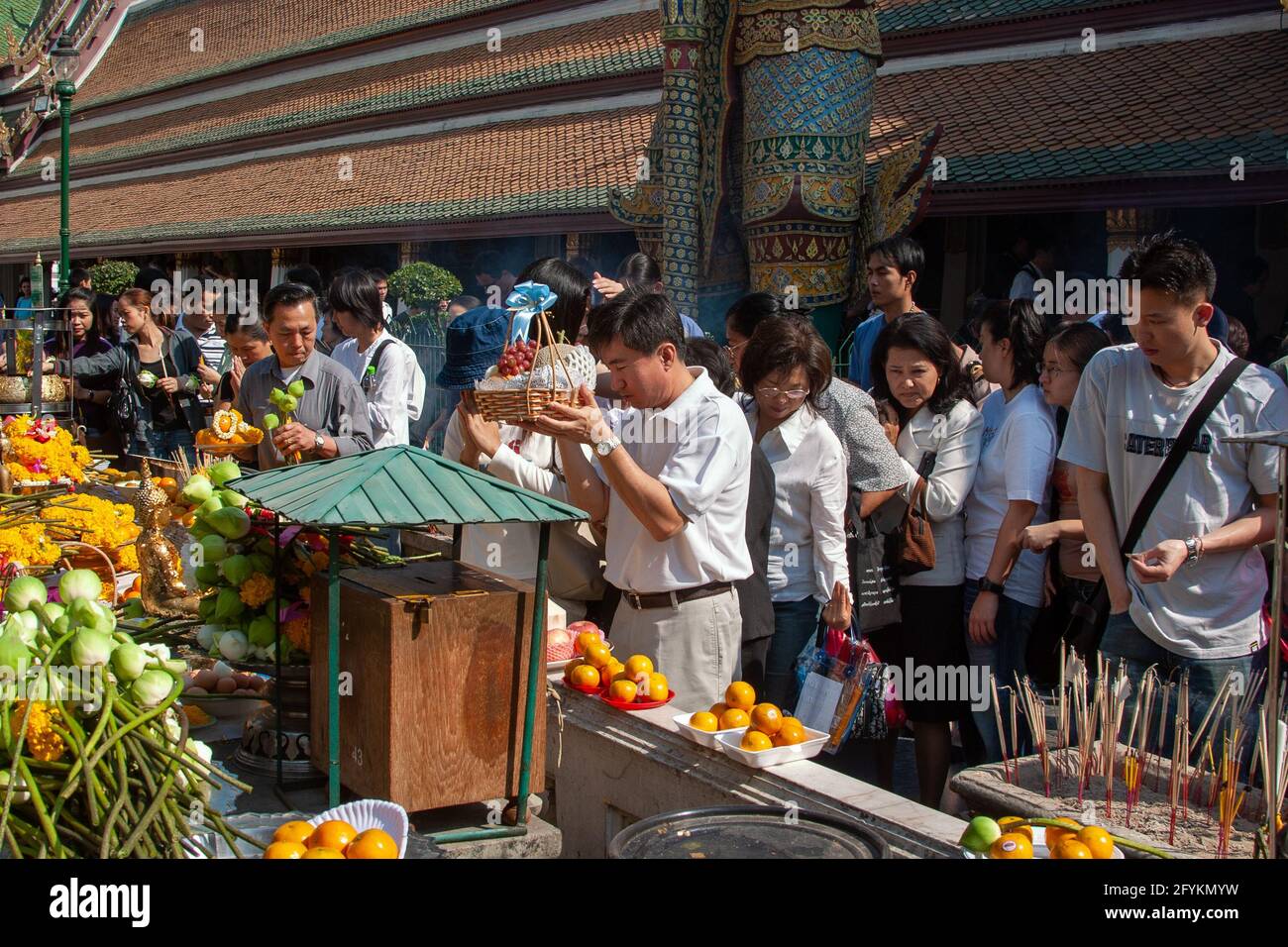 Buddhist pilgrims at Wat Phra Kaew (commonly known in English as the ...