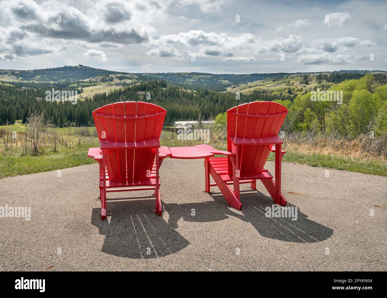 Two red chairs overlooking Fort Walsh National Historic Site in the ...