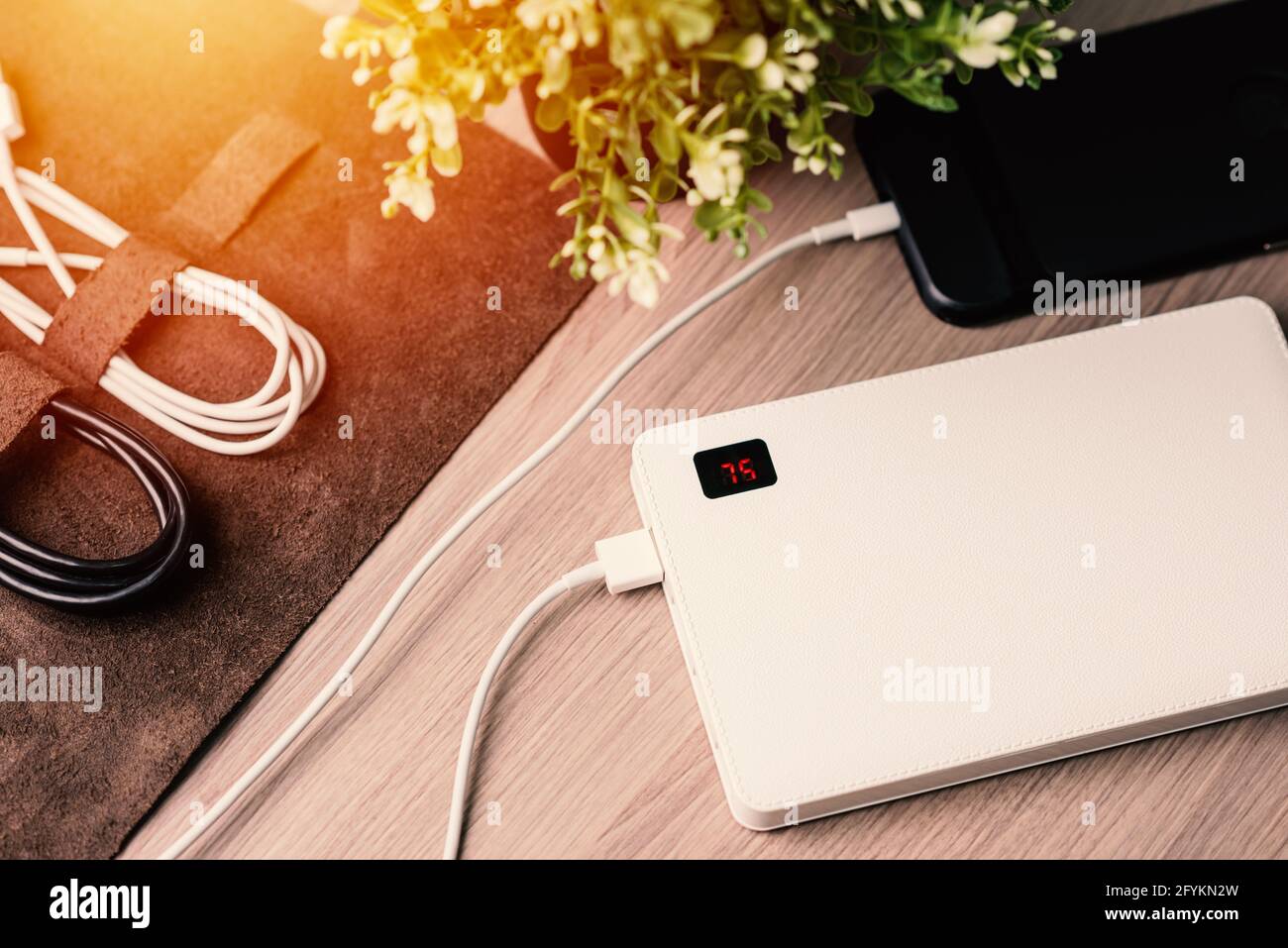 Charging the empty battery smartphone with white power bank Stock Photo ...