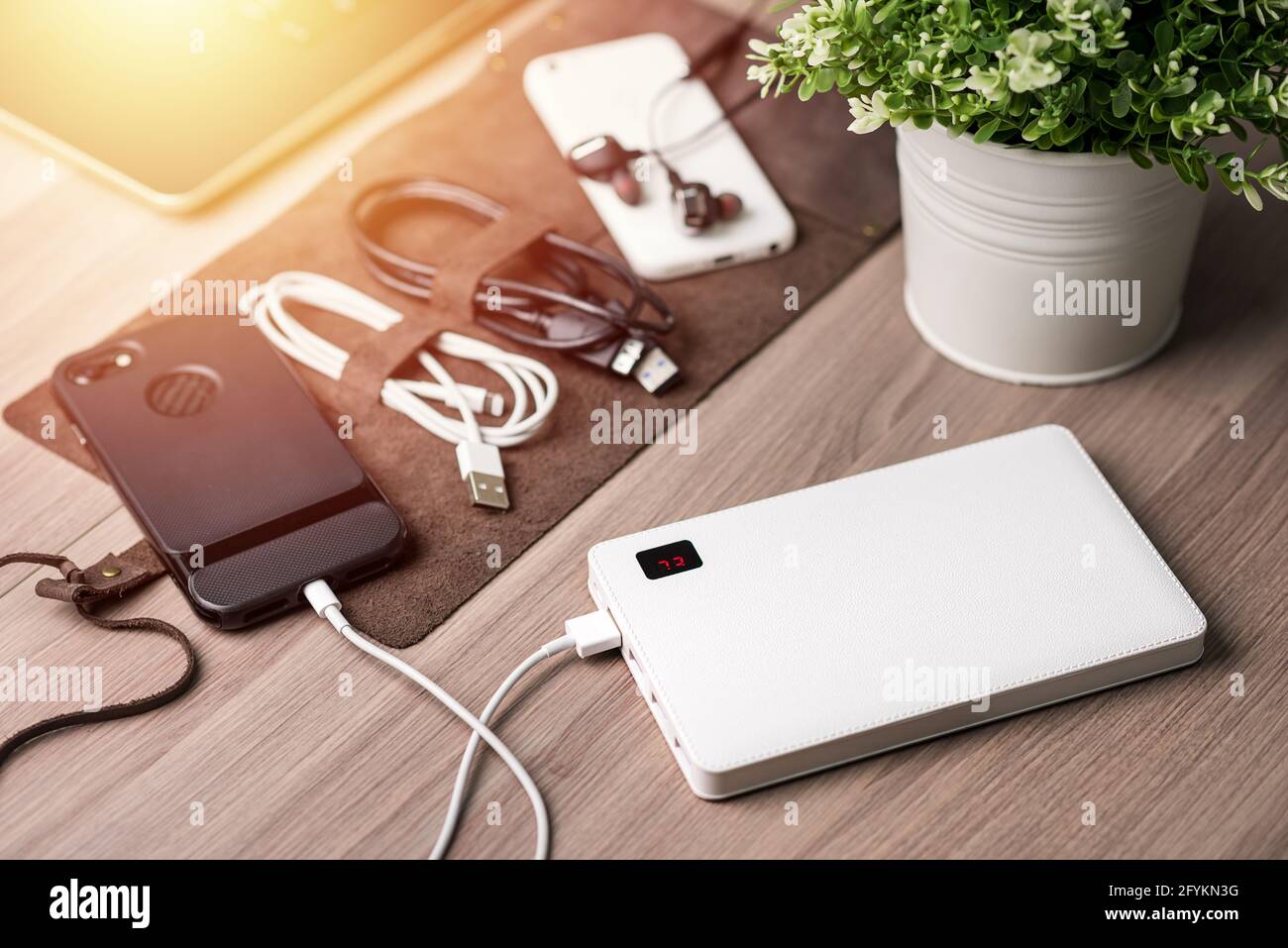 Charging the empty battery smartphone with white power bank Stock Photo ...