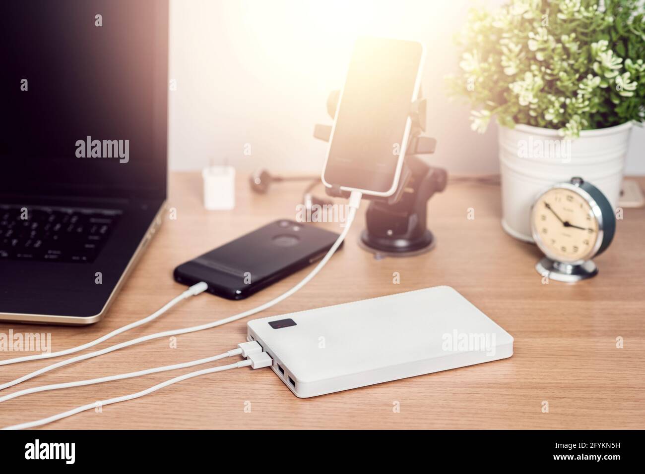 Charging the empty battery smartphone with white power bank Stock Photo ...