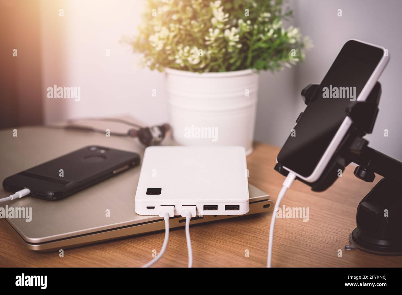 Charging the empty battery smartphone with white power bank Stock Photo ...
