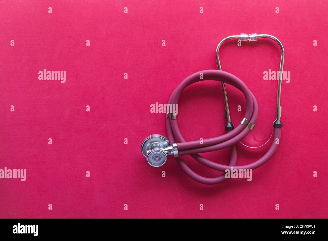 Pink stethoscope, equipment to examine respiration and heartbeat. Pink ...