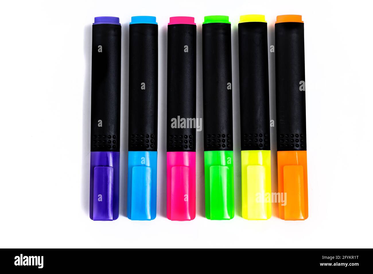 Set of highlighter markers sorted online by color on white background ...