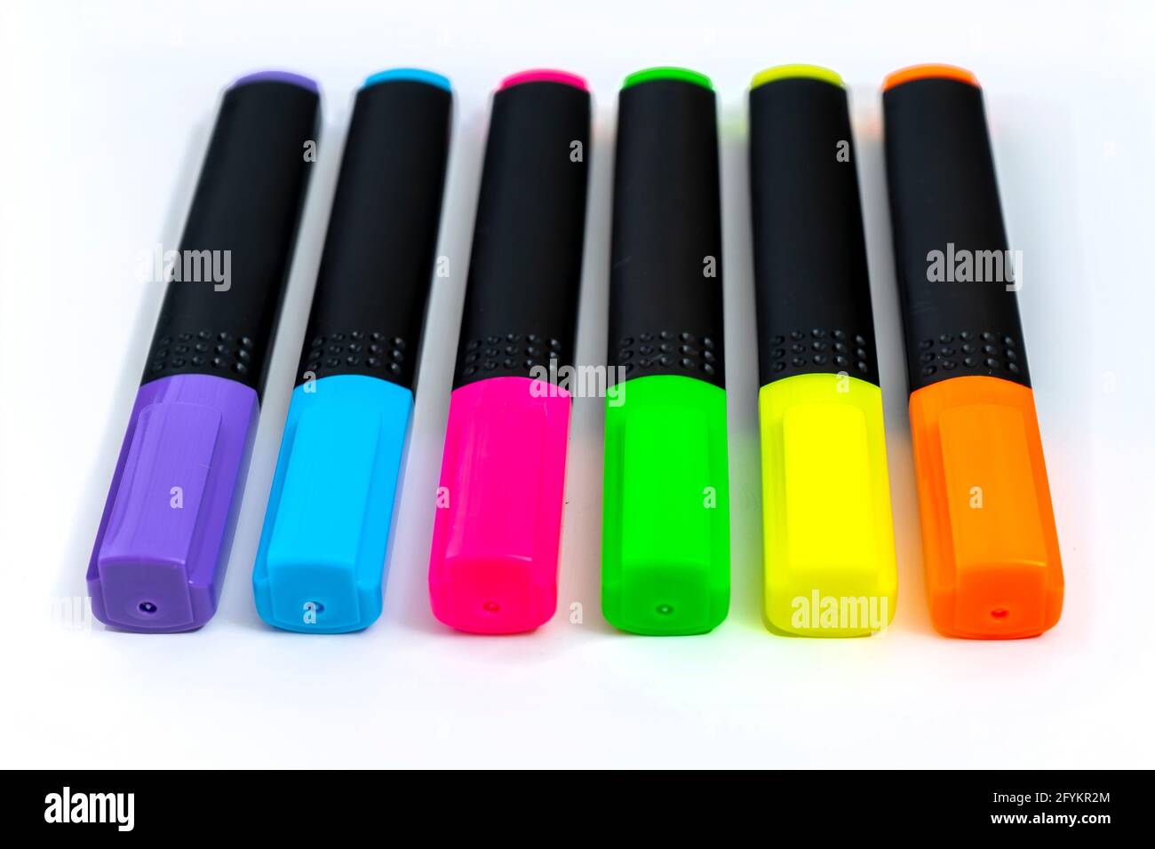 Set of highlighter markers sorted online by color on white background ...