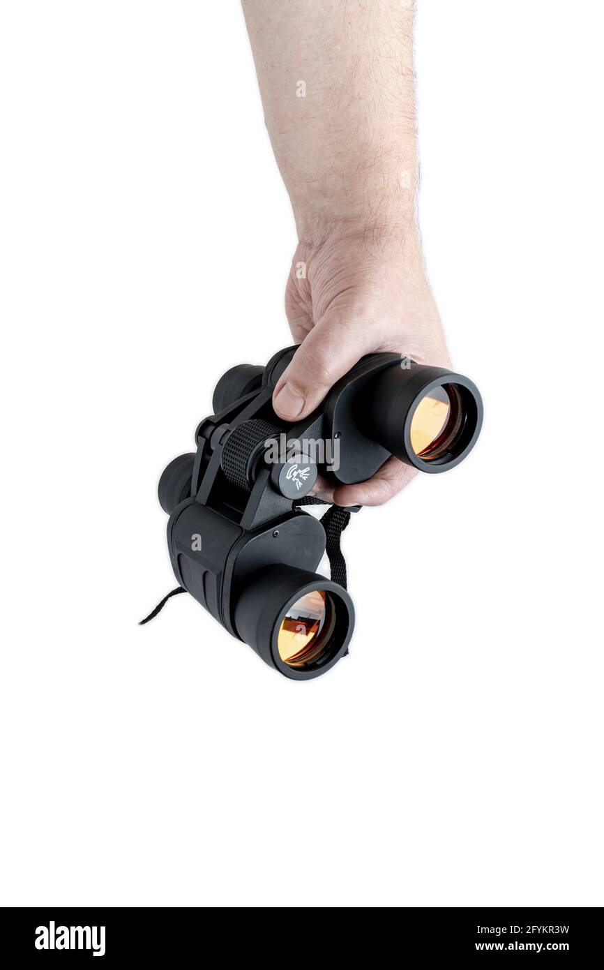 A man's hand holding a pair of binoculars on white background Stock ...