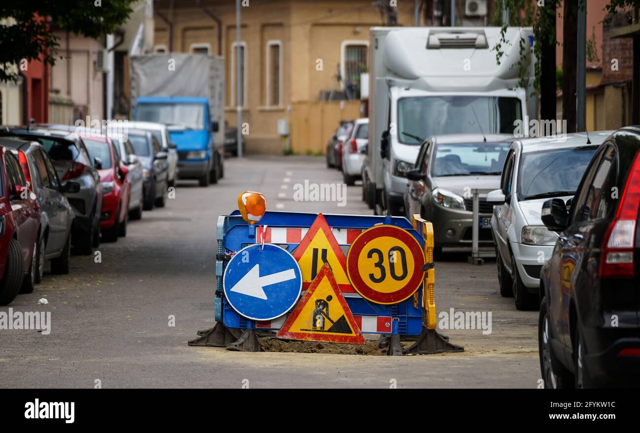 Bucharest, Romania - May 24, 2021: Several traffic signs warn of the ...
