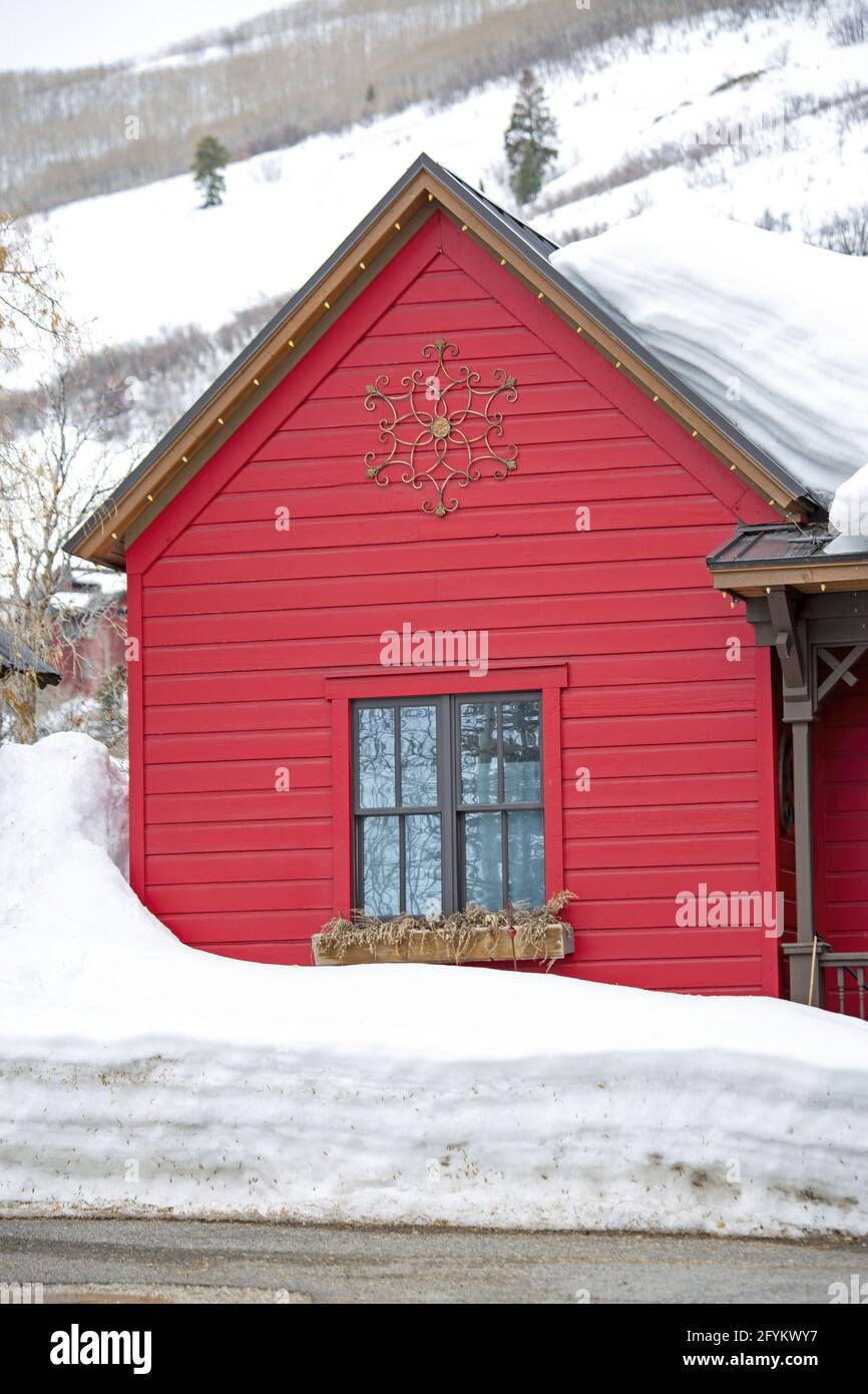 Red country house in a snowy mountain Stock Photo - Alamy