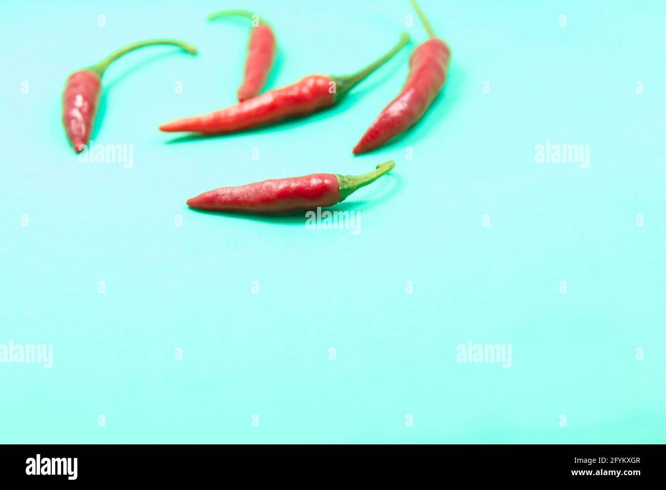 Red chilli on surface, isolated Stock Photo - Alamy