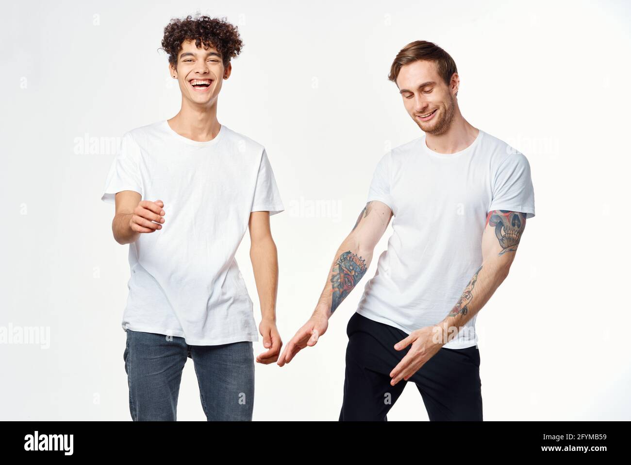 Two young friends wearing t shirts hi-res stock photography and images ...