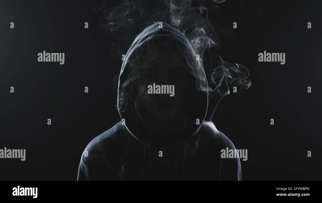 Photo of smoker woman in the shadow Stock Photo - Alamy