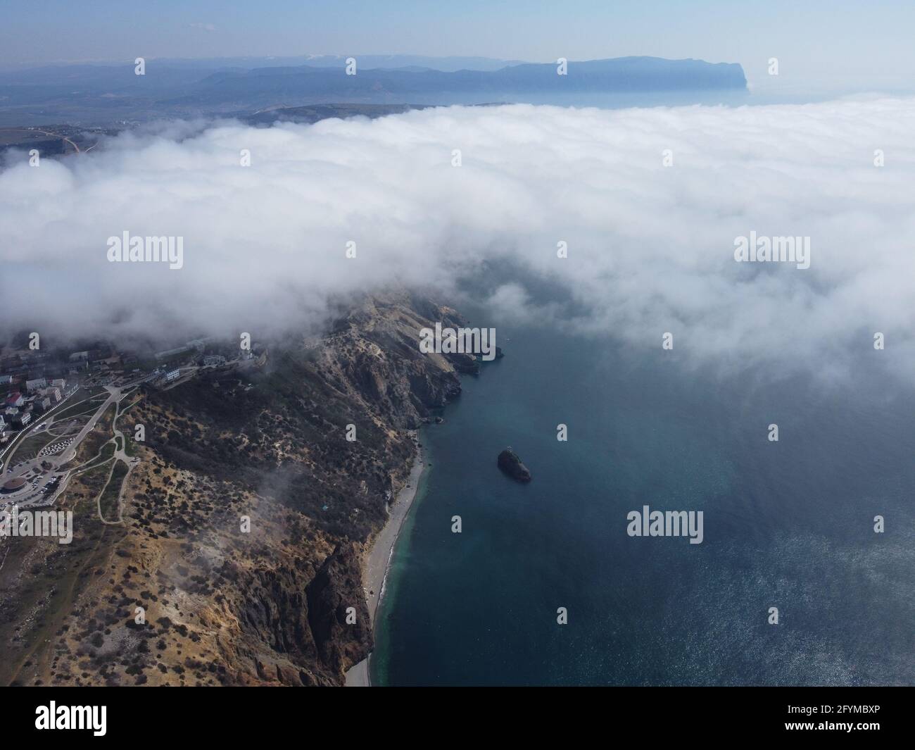 High above the thick fog, like beautiful ocean of clouds at sunrise ...