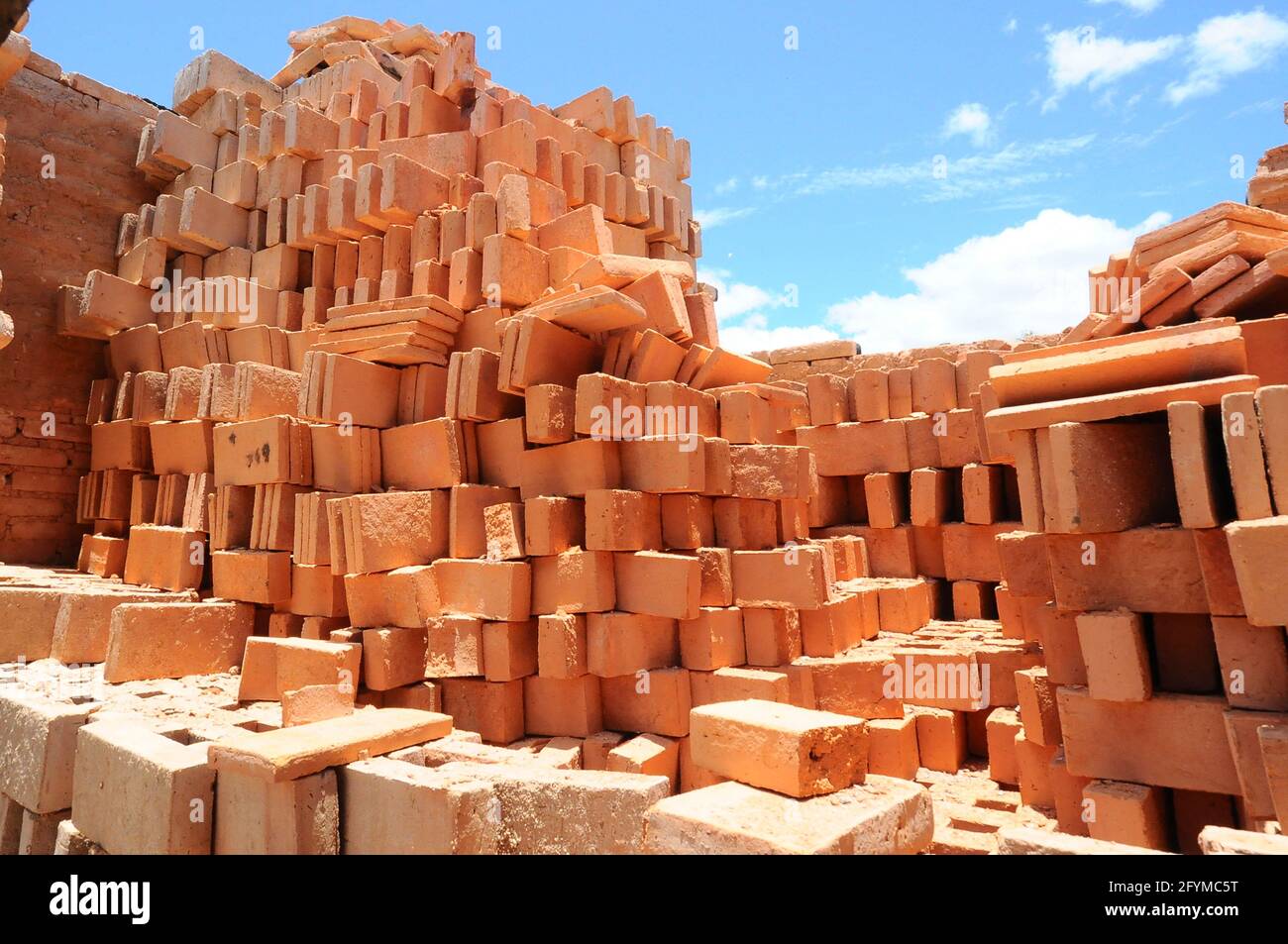A worker is seen during the production of clay partitions, handmade ...