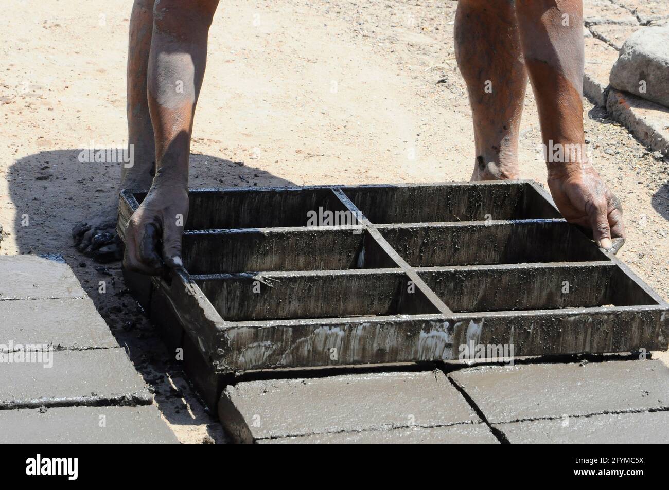 A worker is seen during the production of clay partitions, handmade ...