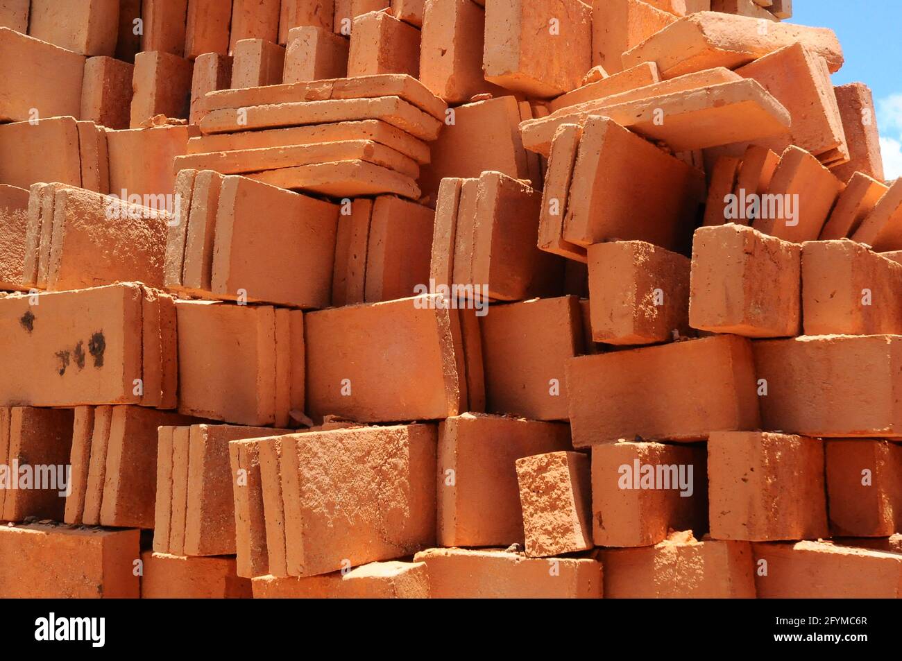 A worker is seen during the production of clay partitions, handmade ...