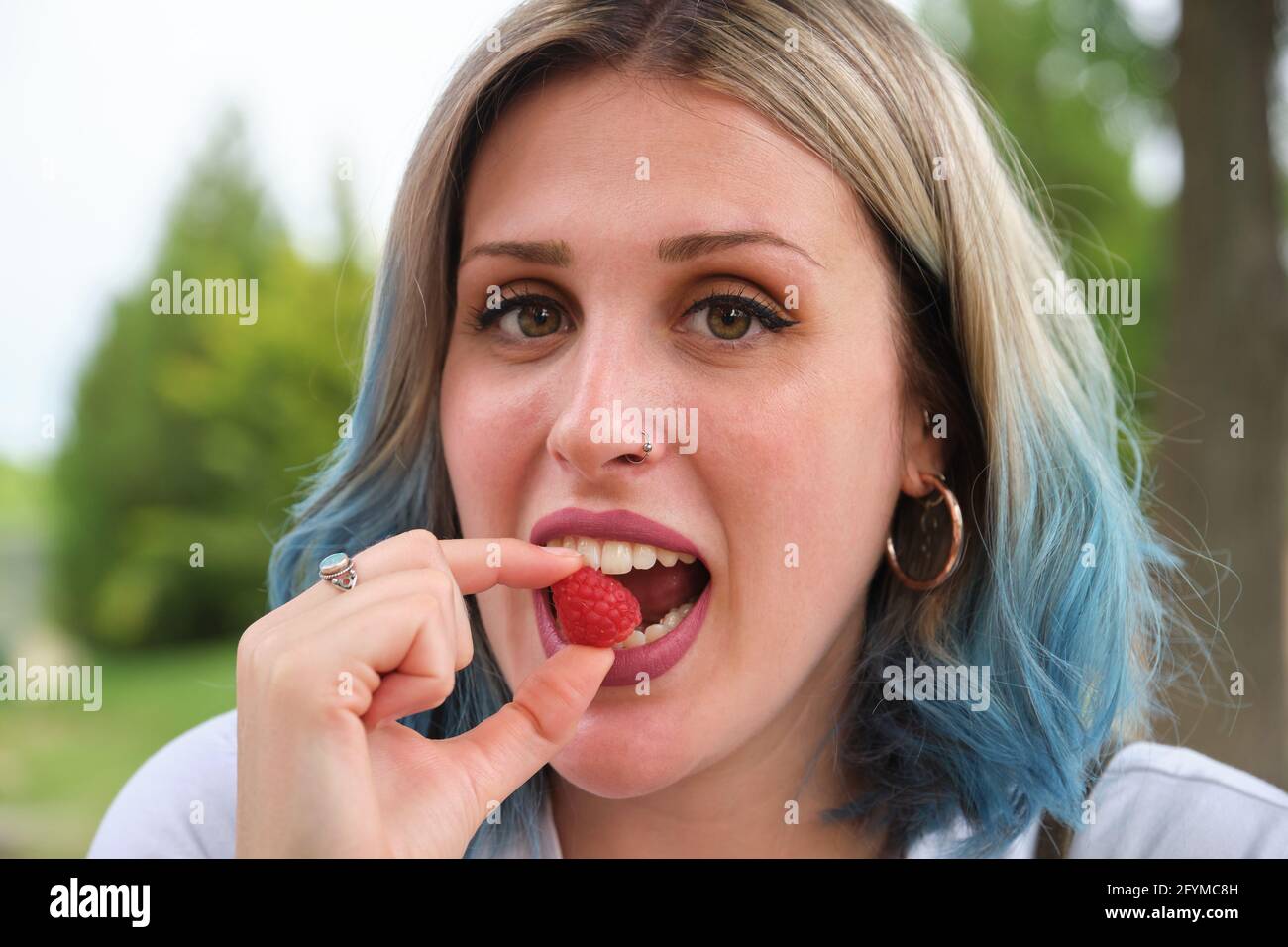 Happy woman eating hi-res stock photography and images - Alamy