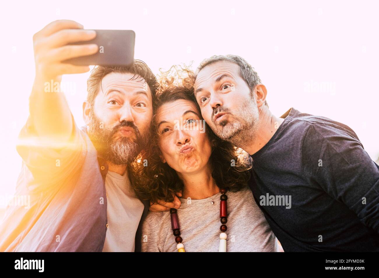 Group Of Three Adult Young Friends Take Selfie Picture Doing Nice