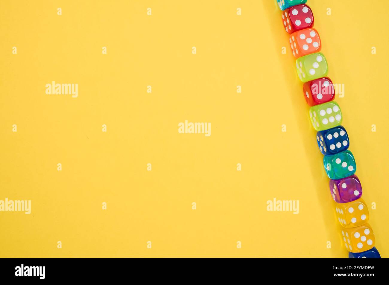 Dice in a row isolated on a yellobackground Stock Photo - Alamy