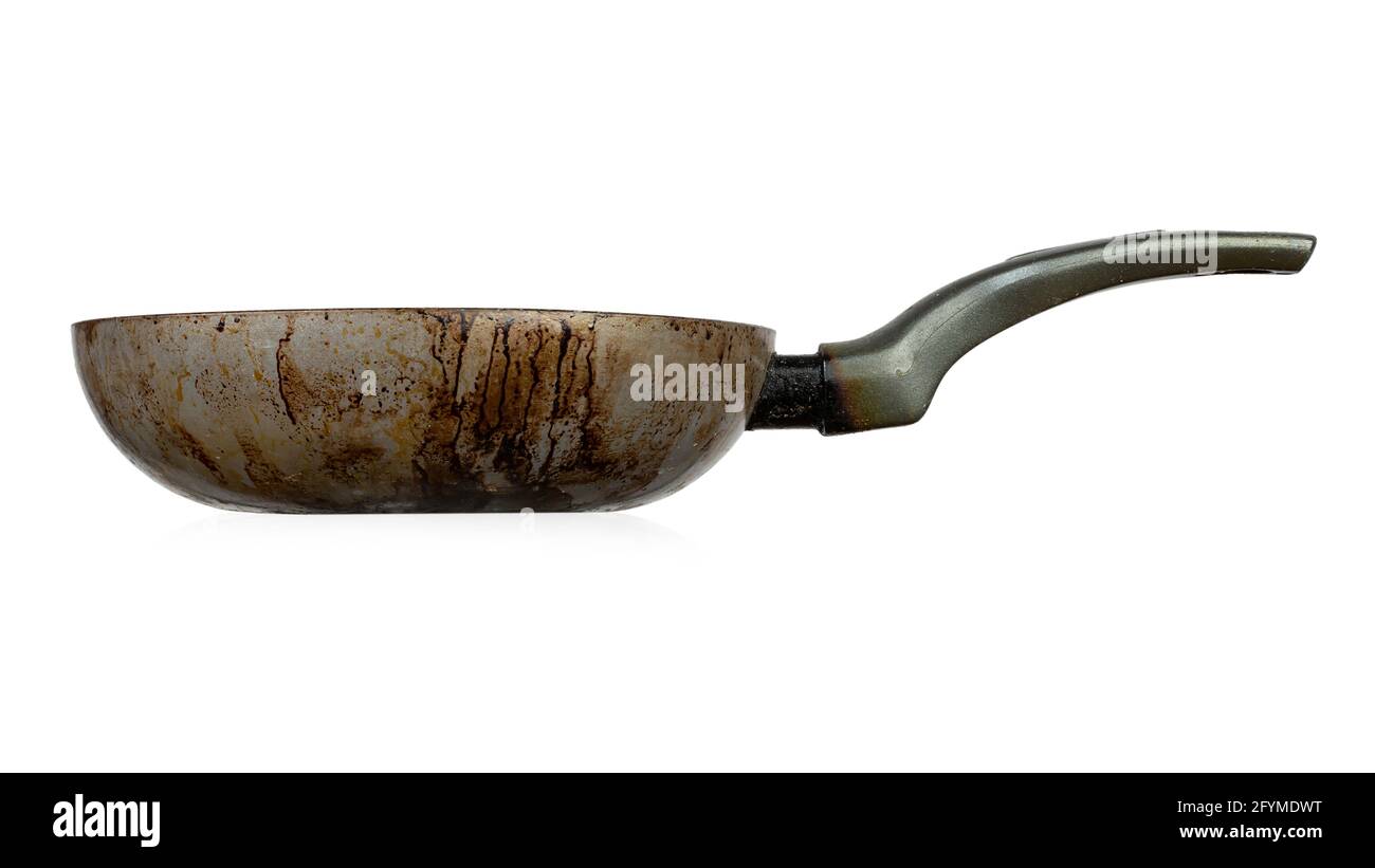 Dirty old frying pan. Isolated on white background. File contains ...