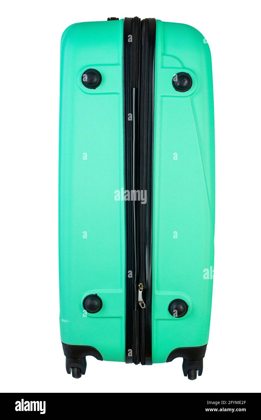 Plastic suitcase turquoise color on wheels for travel. Travel concept ...