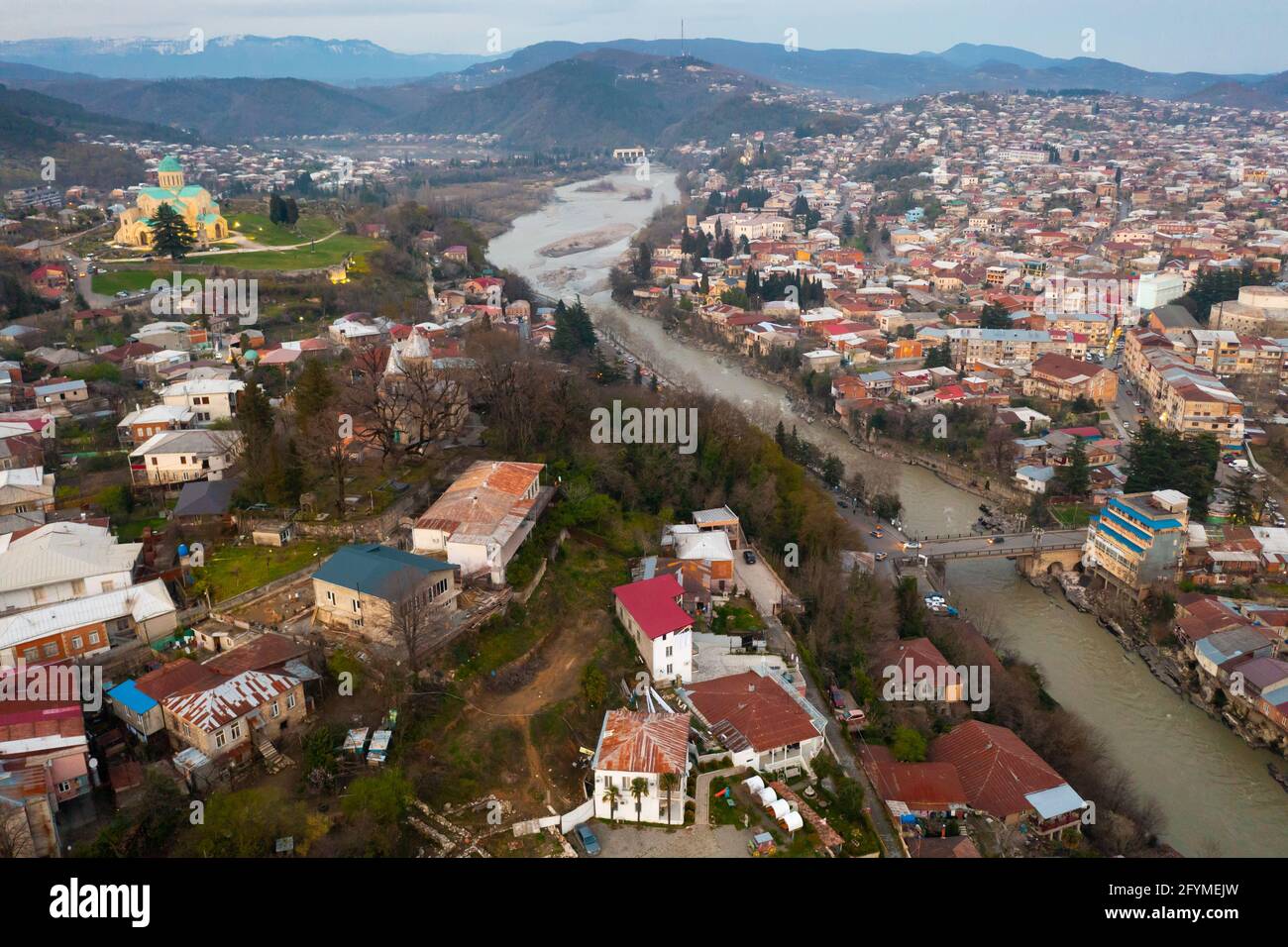 Aerial view of old neighborhoods of Kutaisi located along Rioni river ...