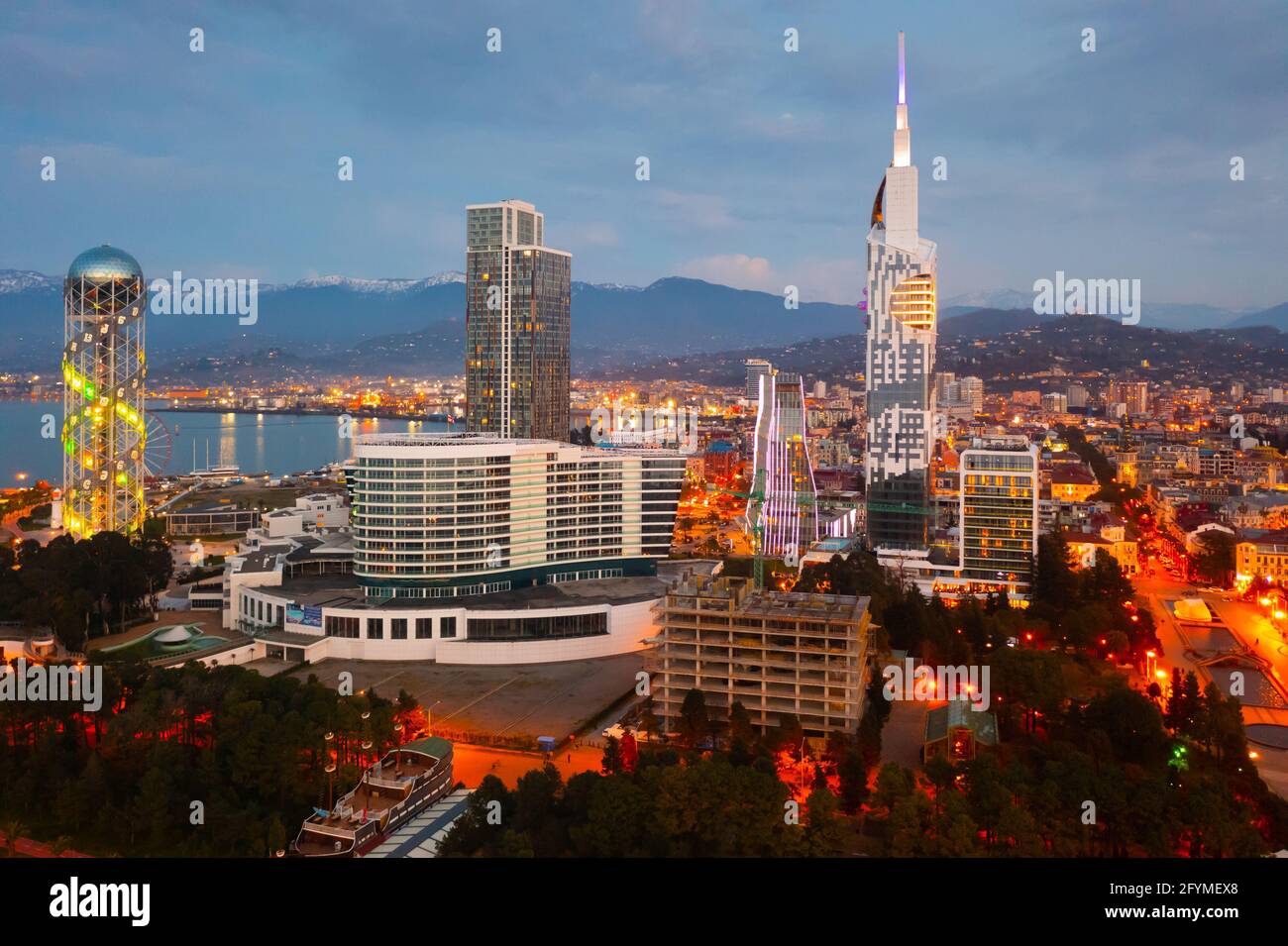 Evening aerial panoramic view of Batumi cityscape on Black sea coast ...