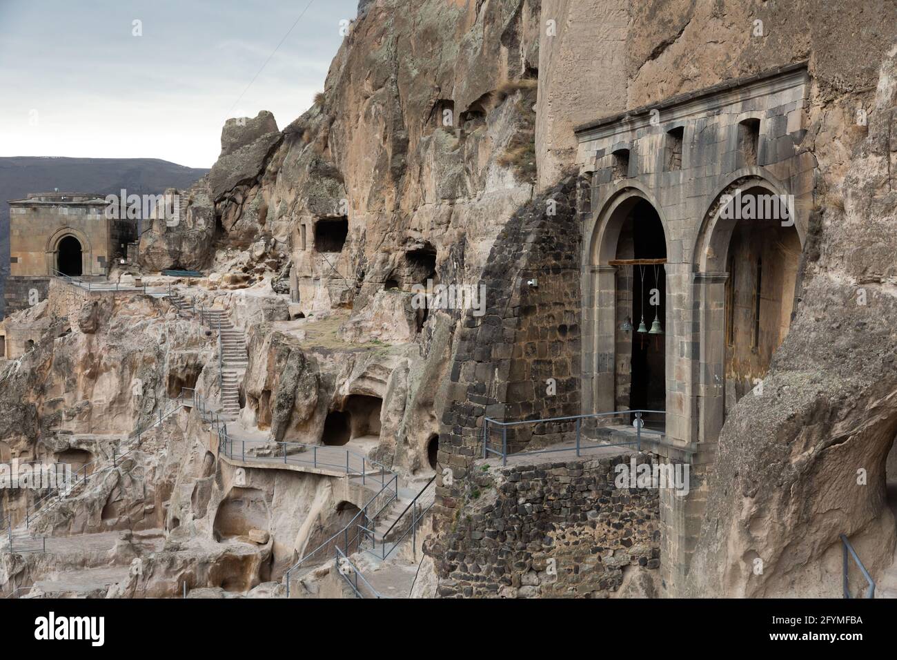 Complex of Vardzia cave monastery structures carved on mountain slope ...