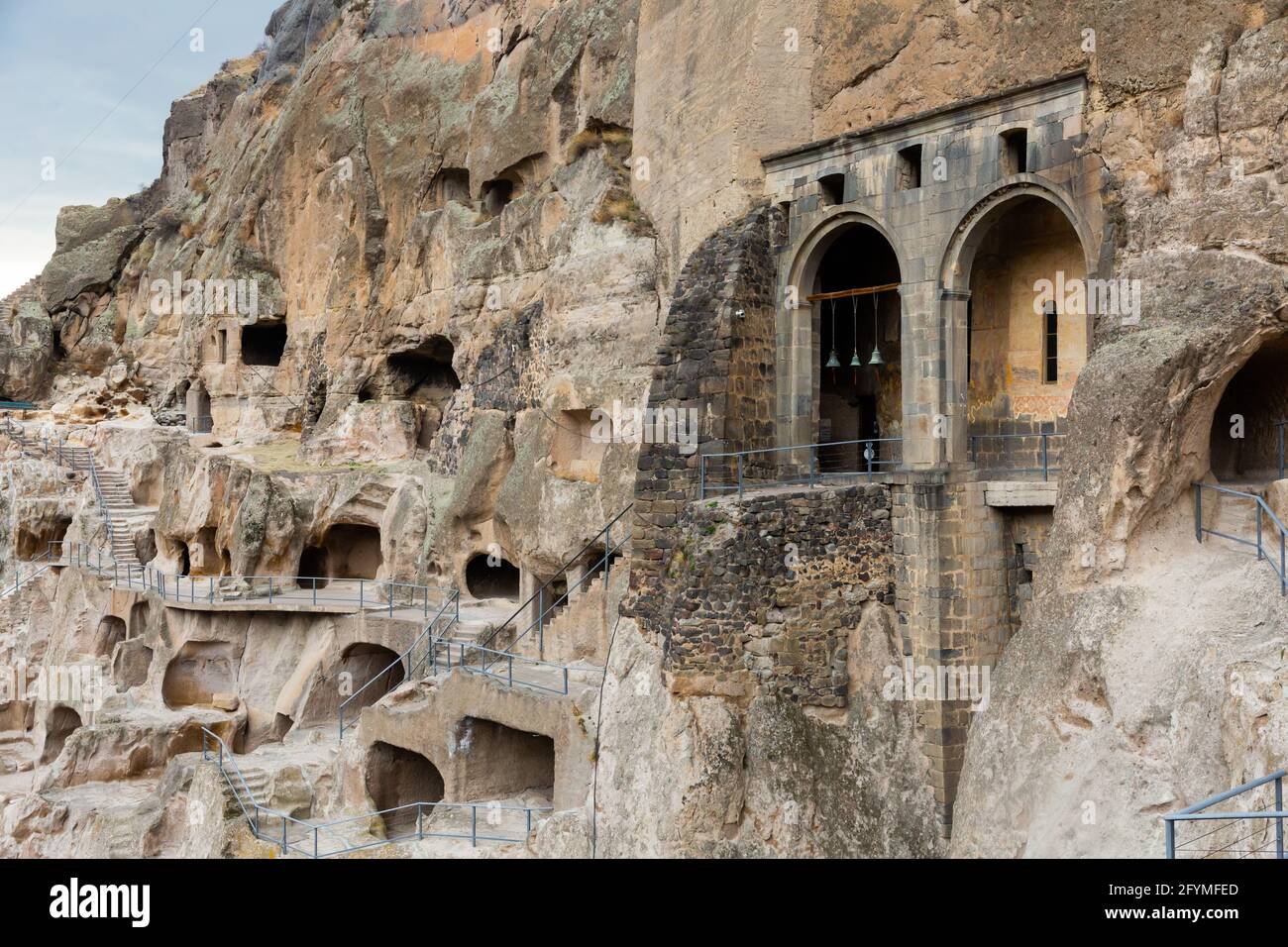 Complex of Vardzia cave monastery structures carved on mountain slope ...